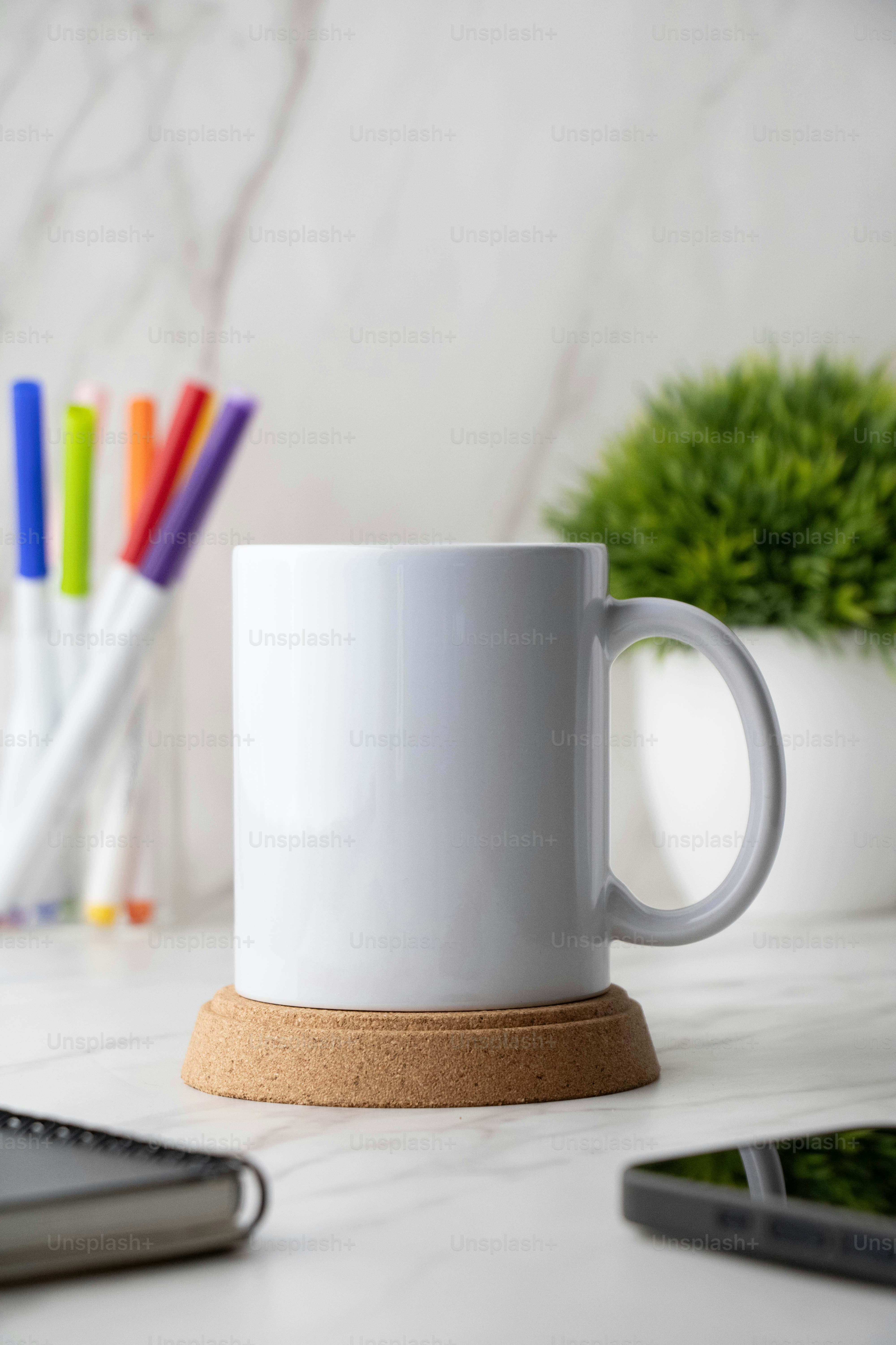 A white coffee mug sitting on top of a counter photo – Mug Image on ...
