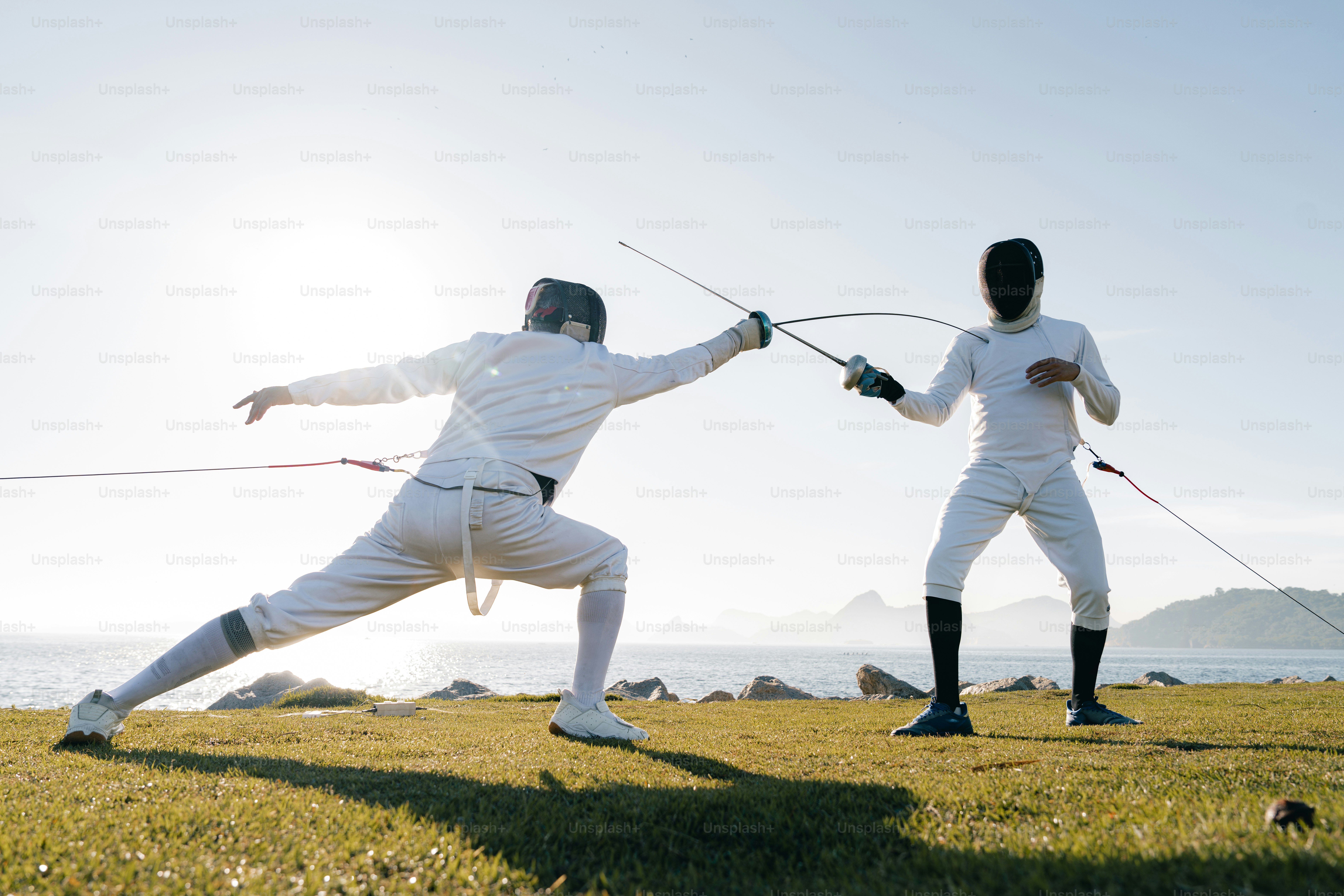 A couple of people that are standing in the grass photo – Sword ...