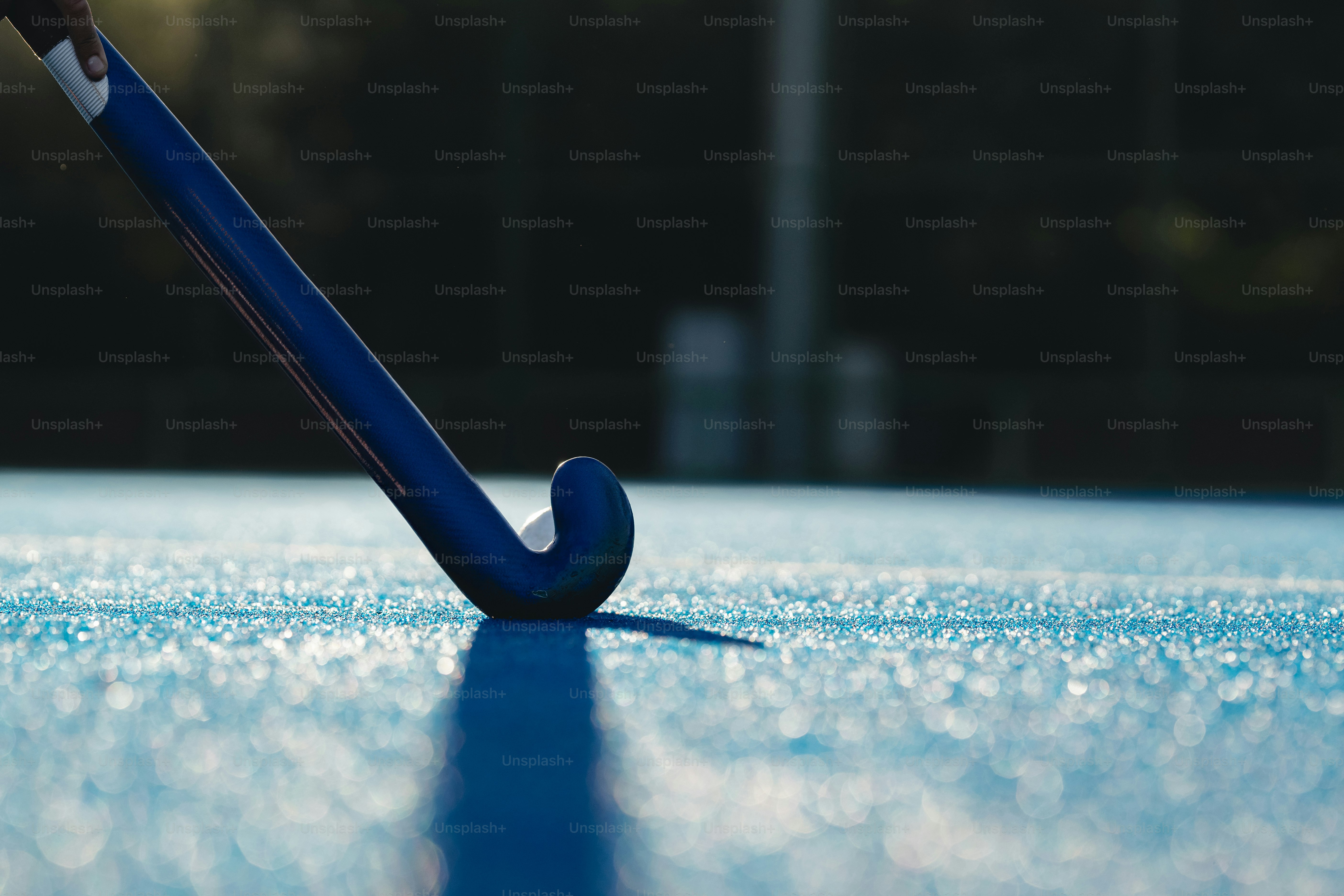 A close up of a hockey stick on the ground photo – Hockey Image on Unsplash