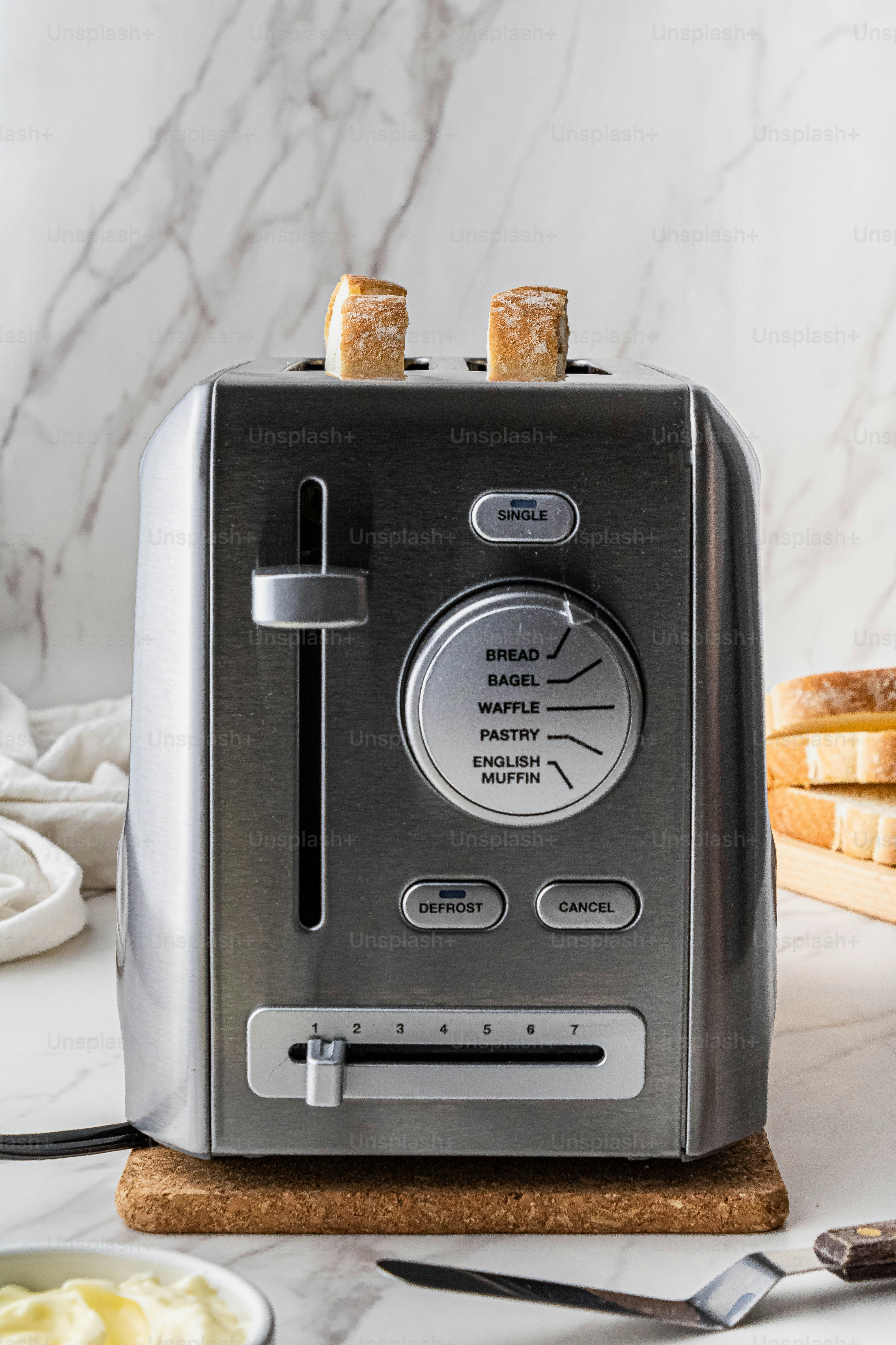 A toaster sitting on top of a white counter photo – Food Image on Unsplash
