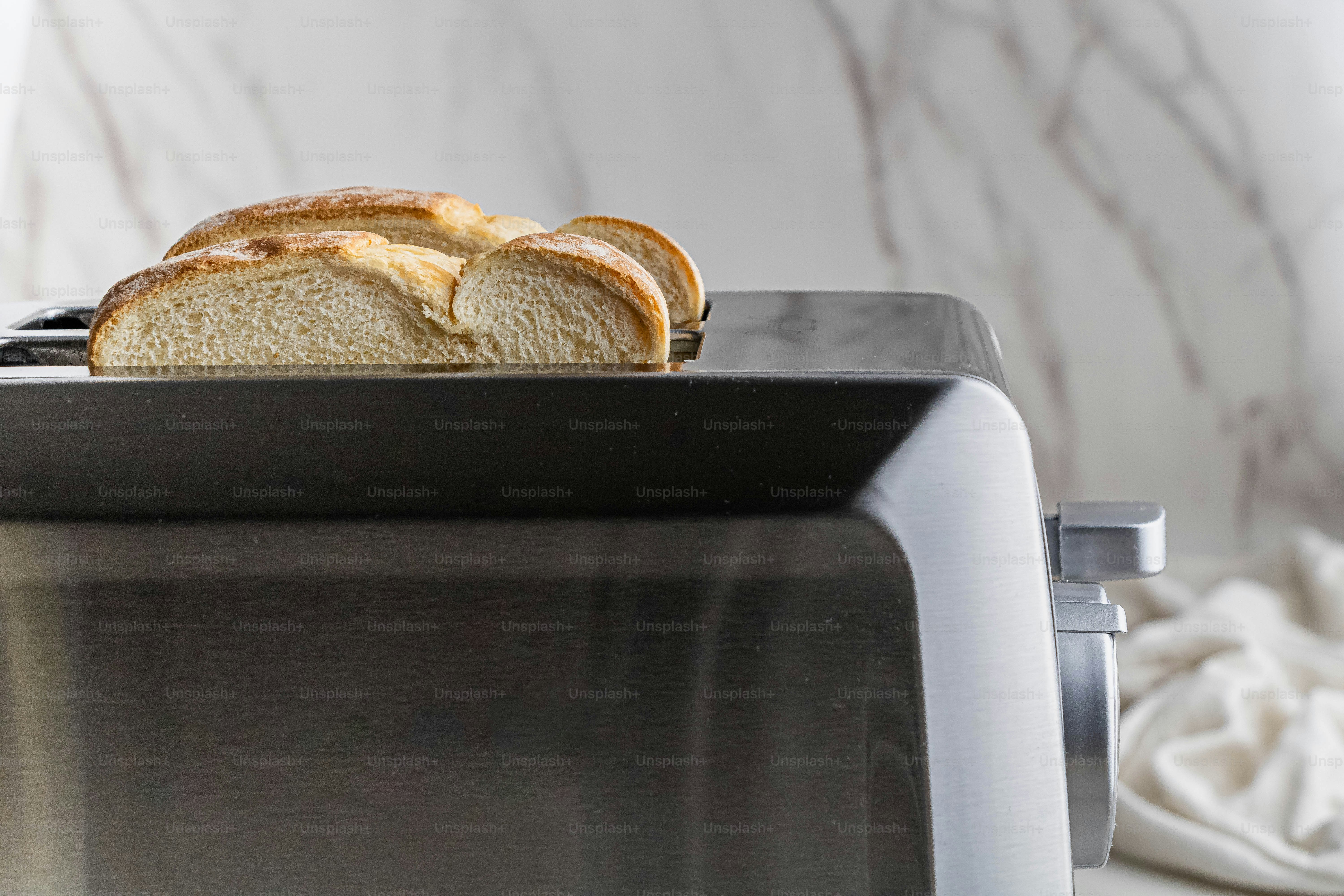 A toaster sitting on top of a white counter photo – Food Image on Unsplash