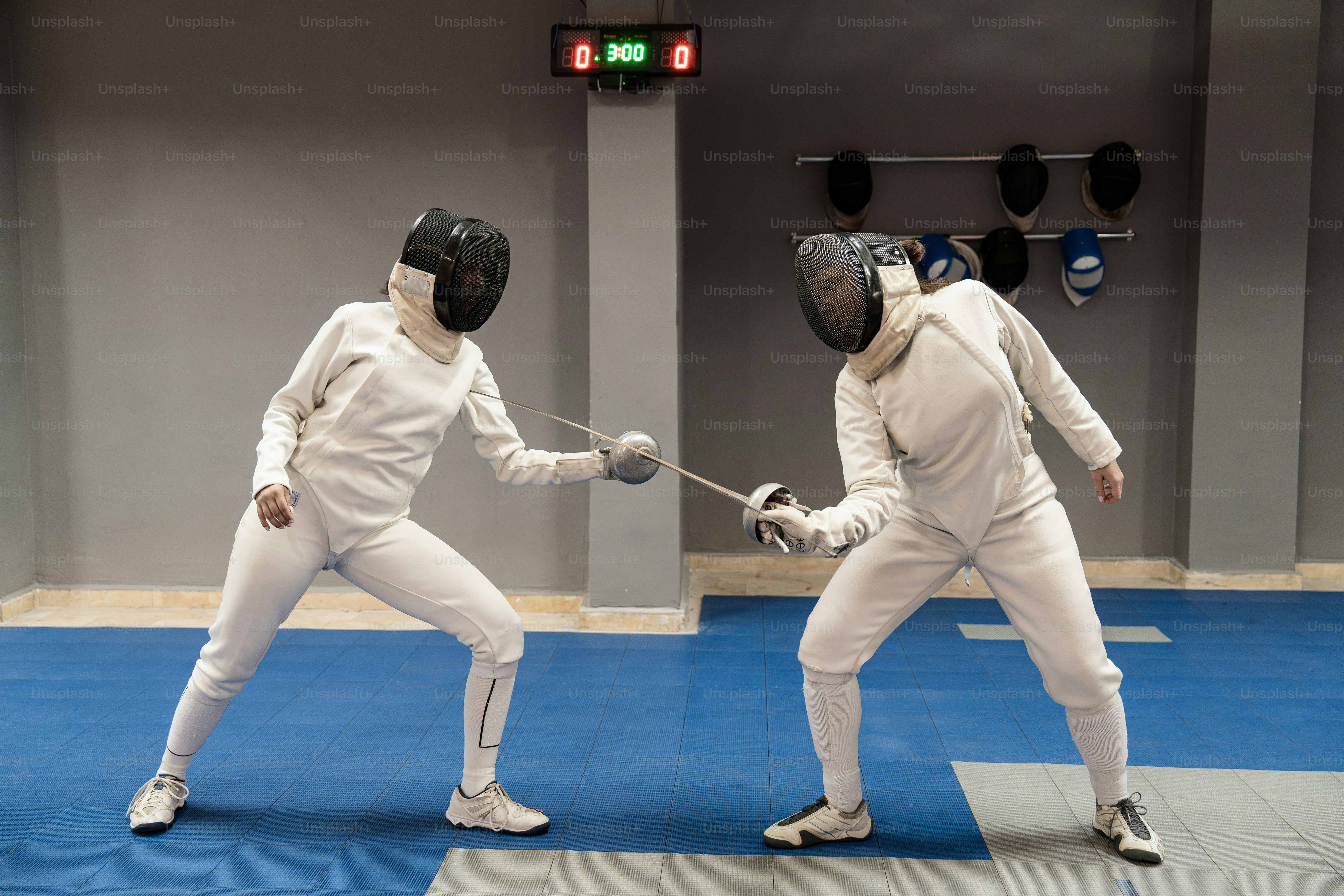 A couple of men in fencing gear in a room photo – Sports Image on Unsplash