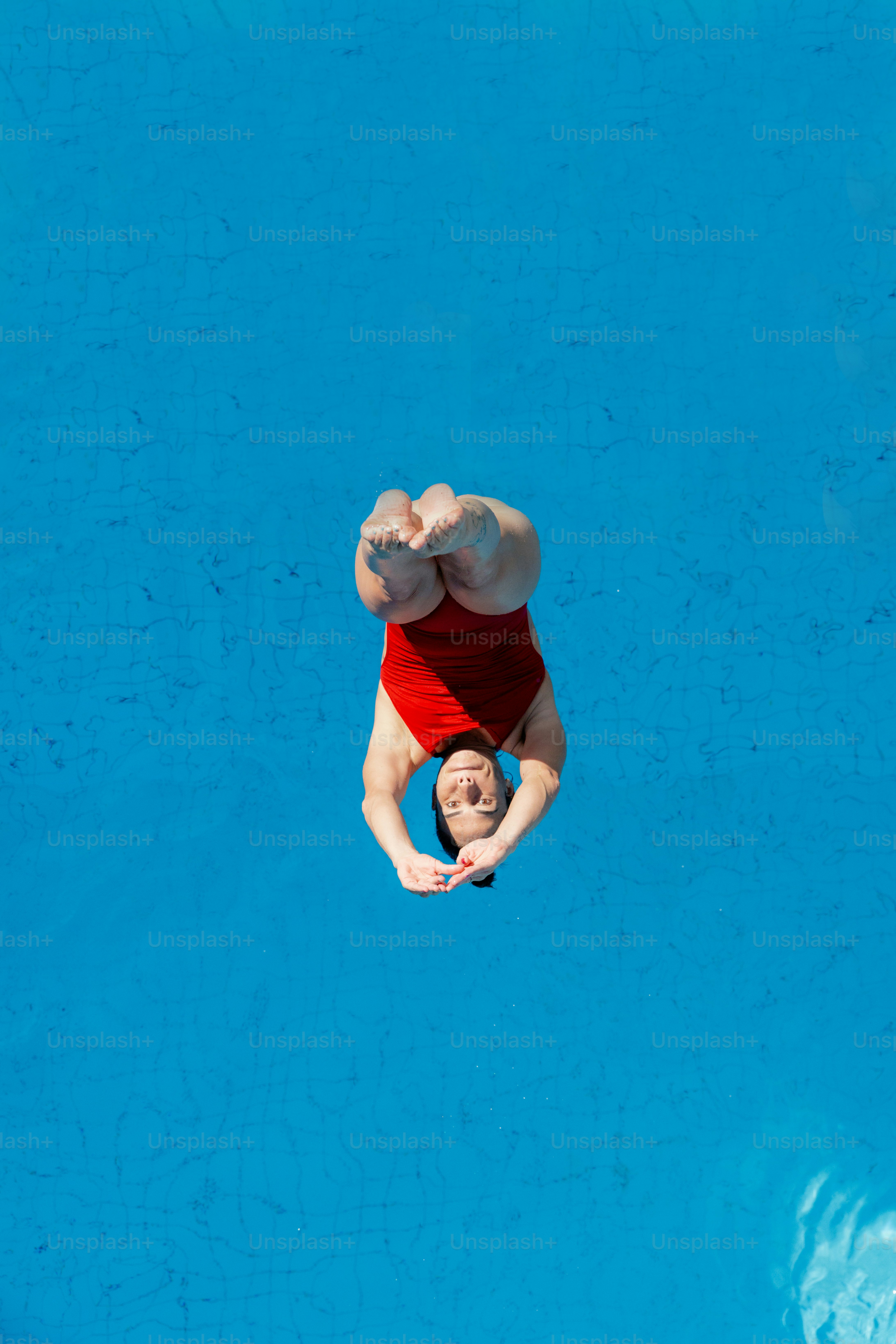 A man diving into a swimming pool photo – Olympics Image on Unsplash