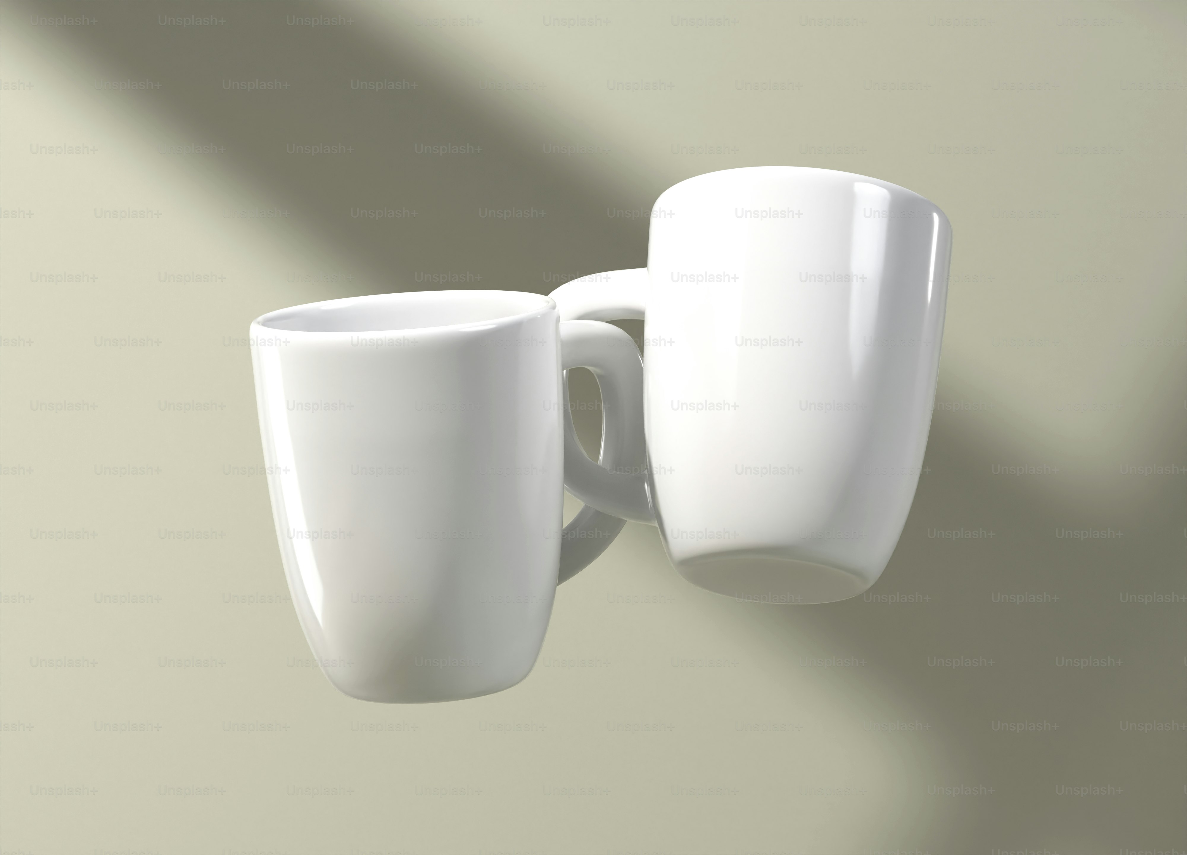 A pair of white cups hanging from a wall photo – Branding Image on Unsplash