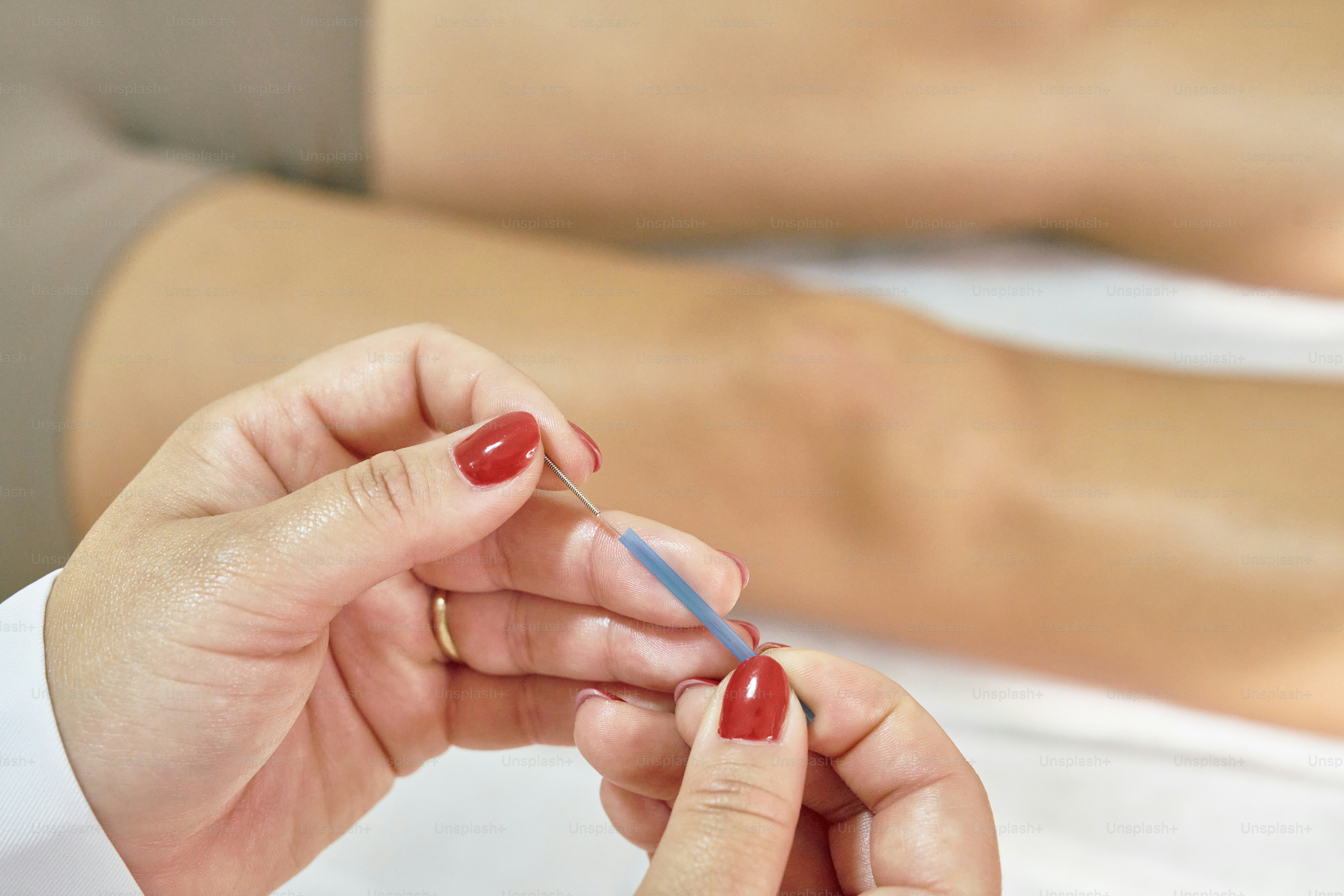 A woman with red nail polish on her nails photo – Needles Image on Unsplash