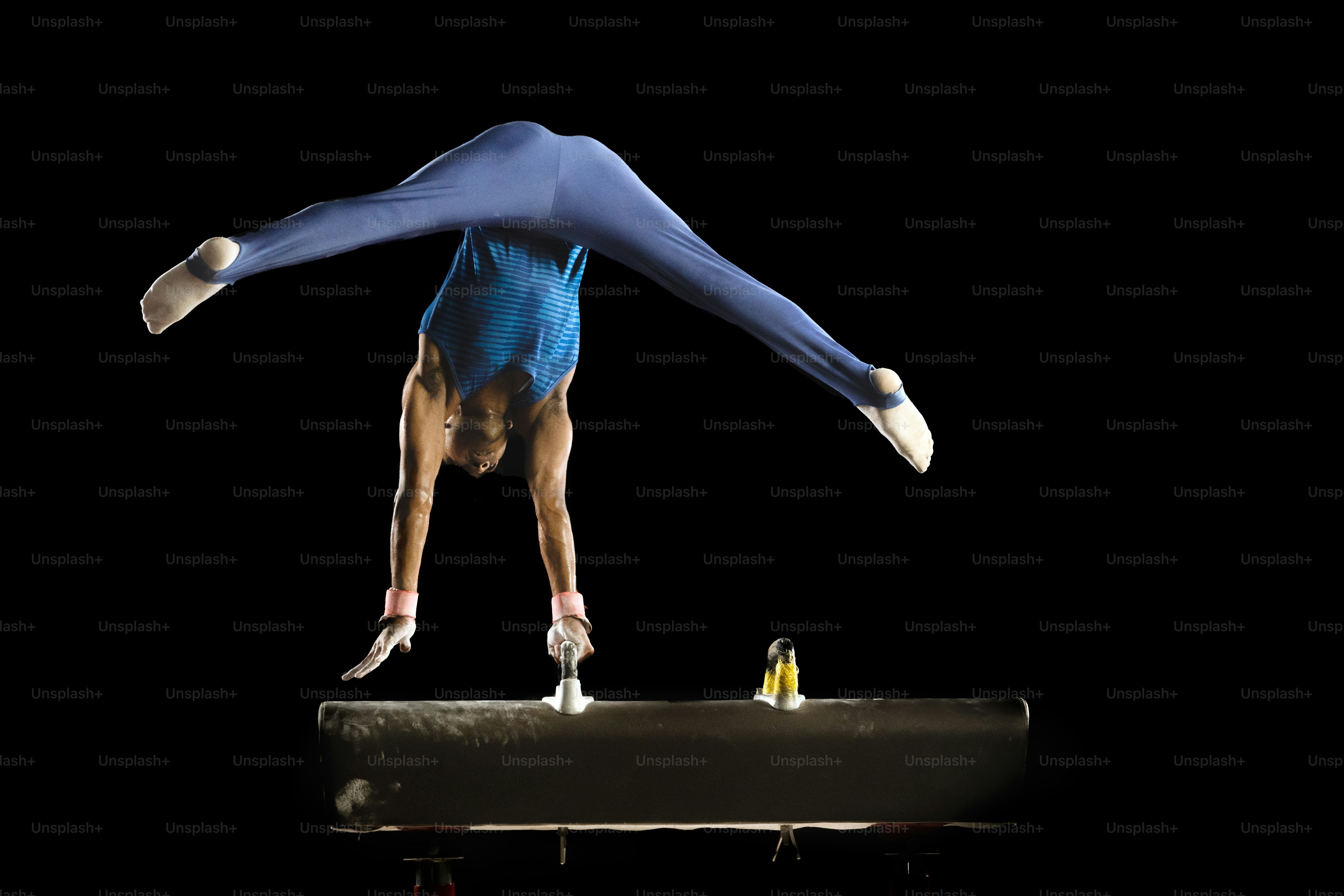 A person doing a handstand on a balance beam photo – Sports Image on ...