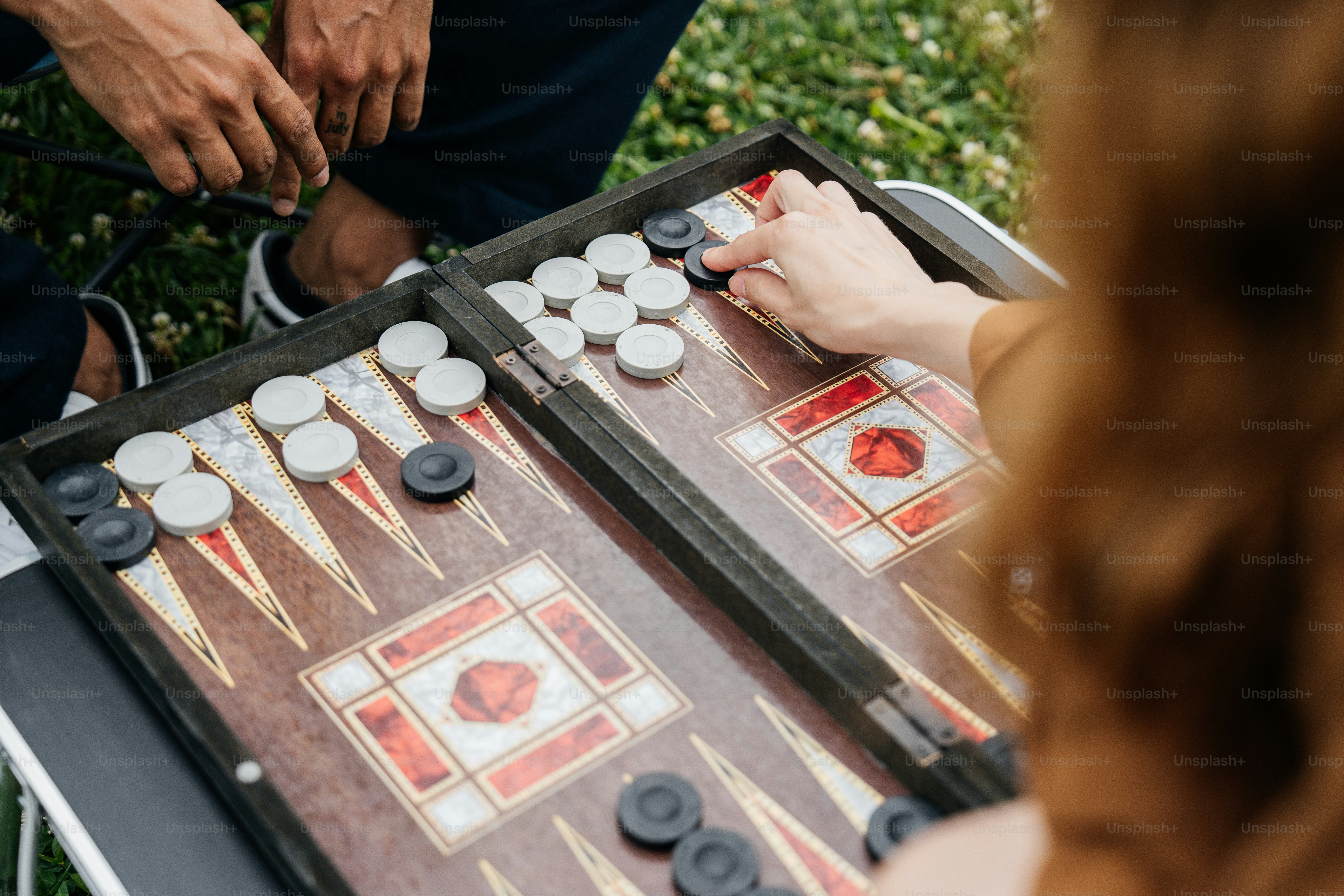 A group of people playing a game of checkers photo – Game Image on Unsplash