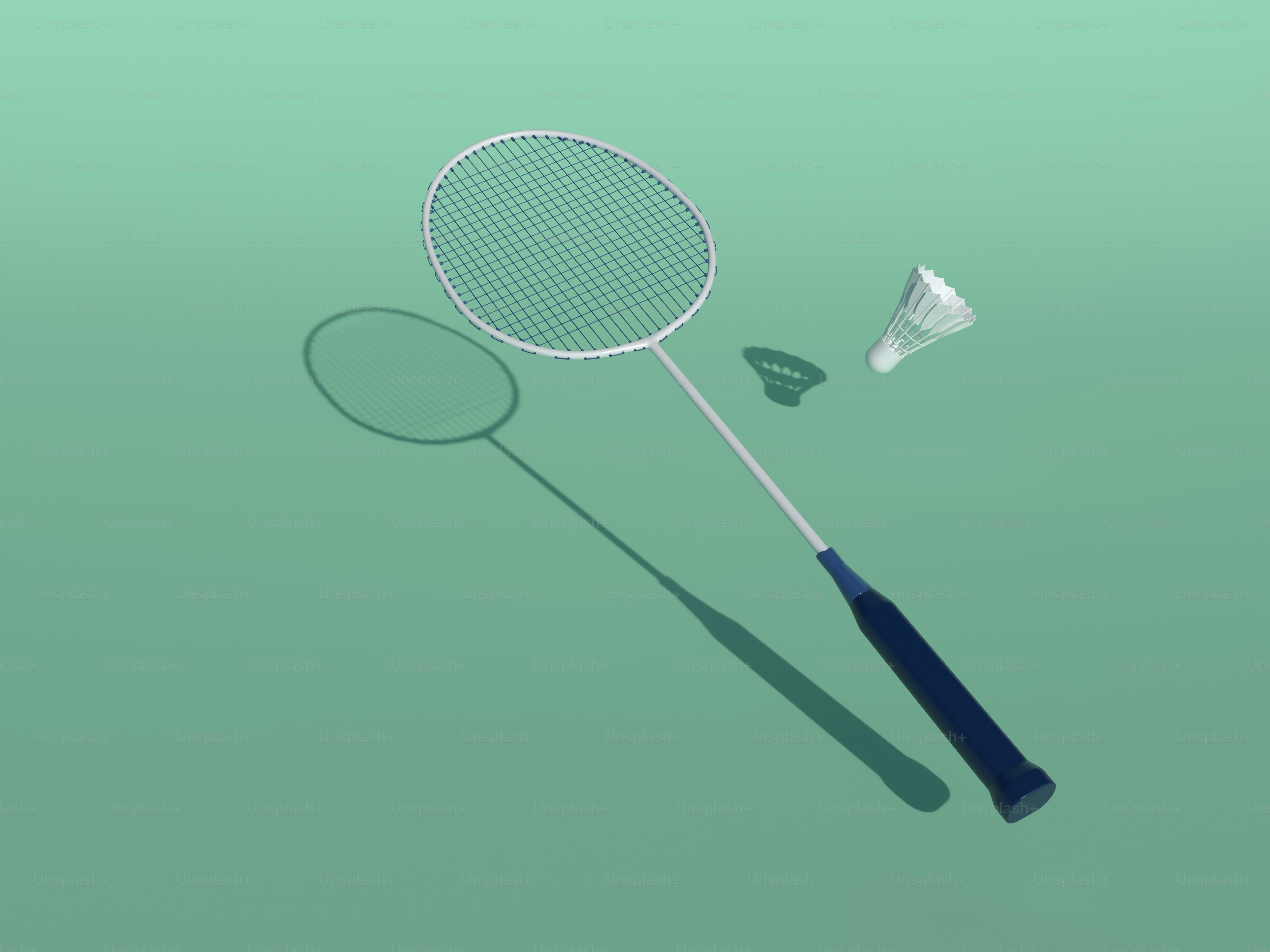 A badminton racket and a shuttle on a green background photo ...