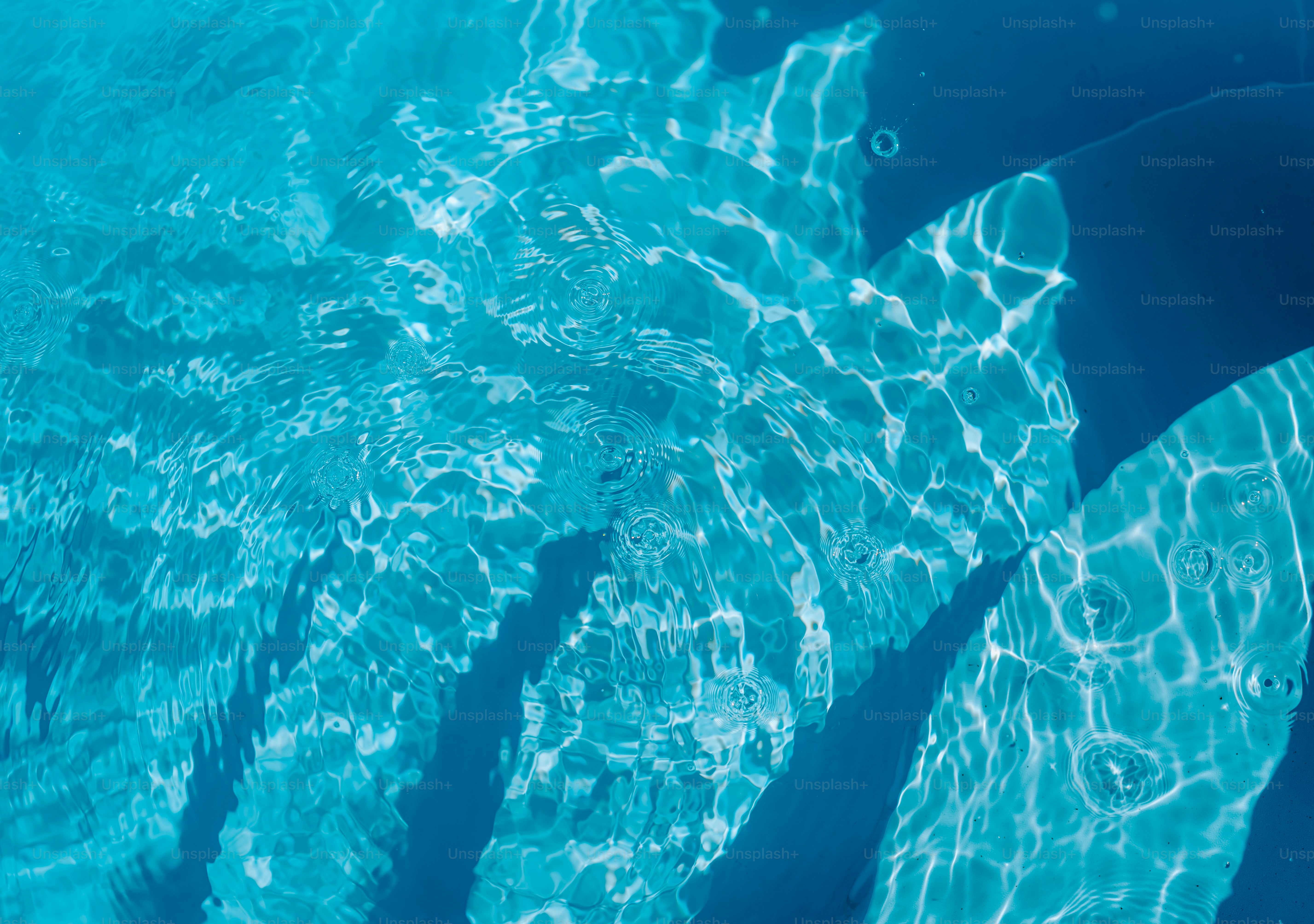 A pool with blue water and ripples of water photo – Summer wallpaper ...