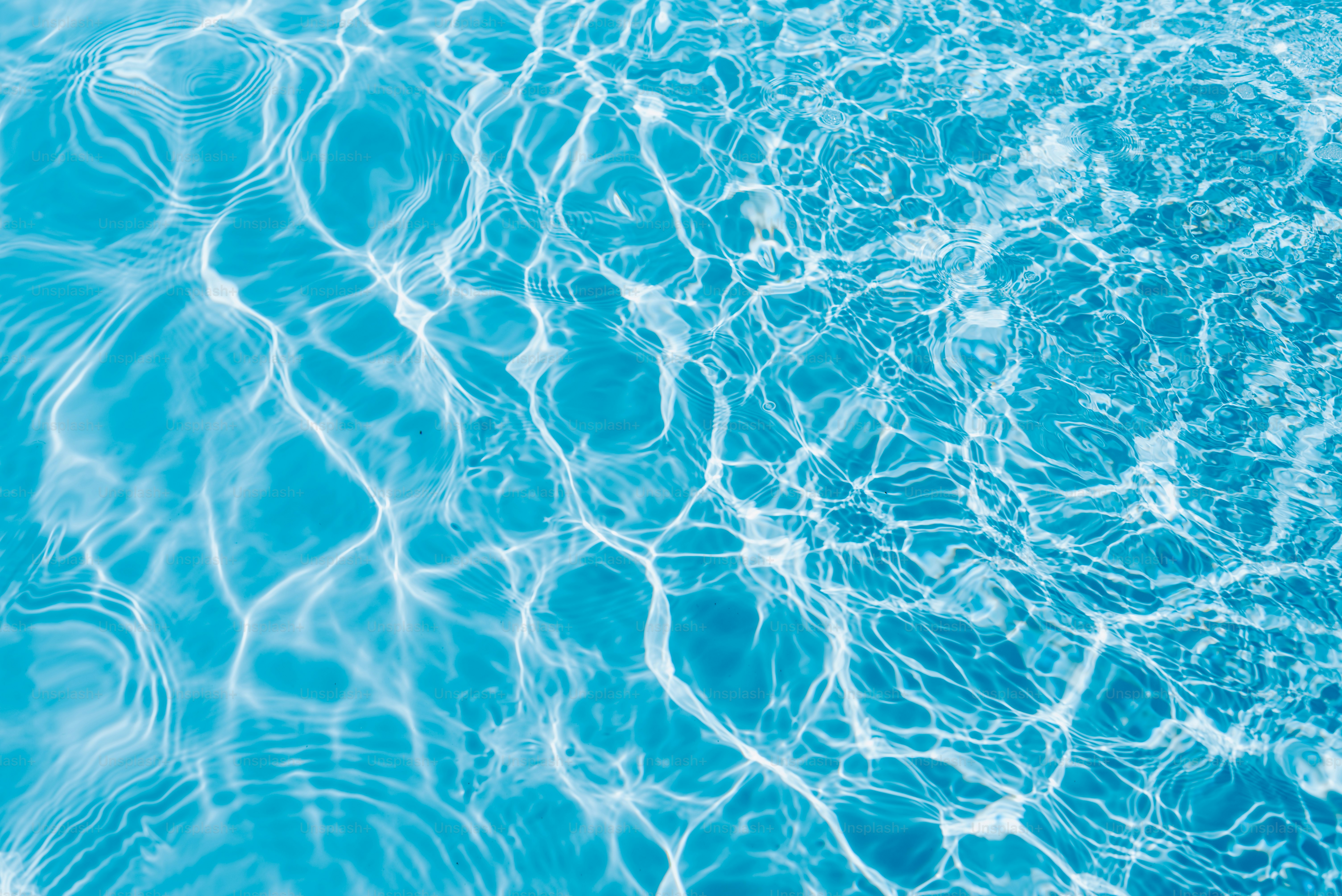 A pool with blue water and ripples of water photo – Wallpaper Image on ...