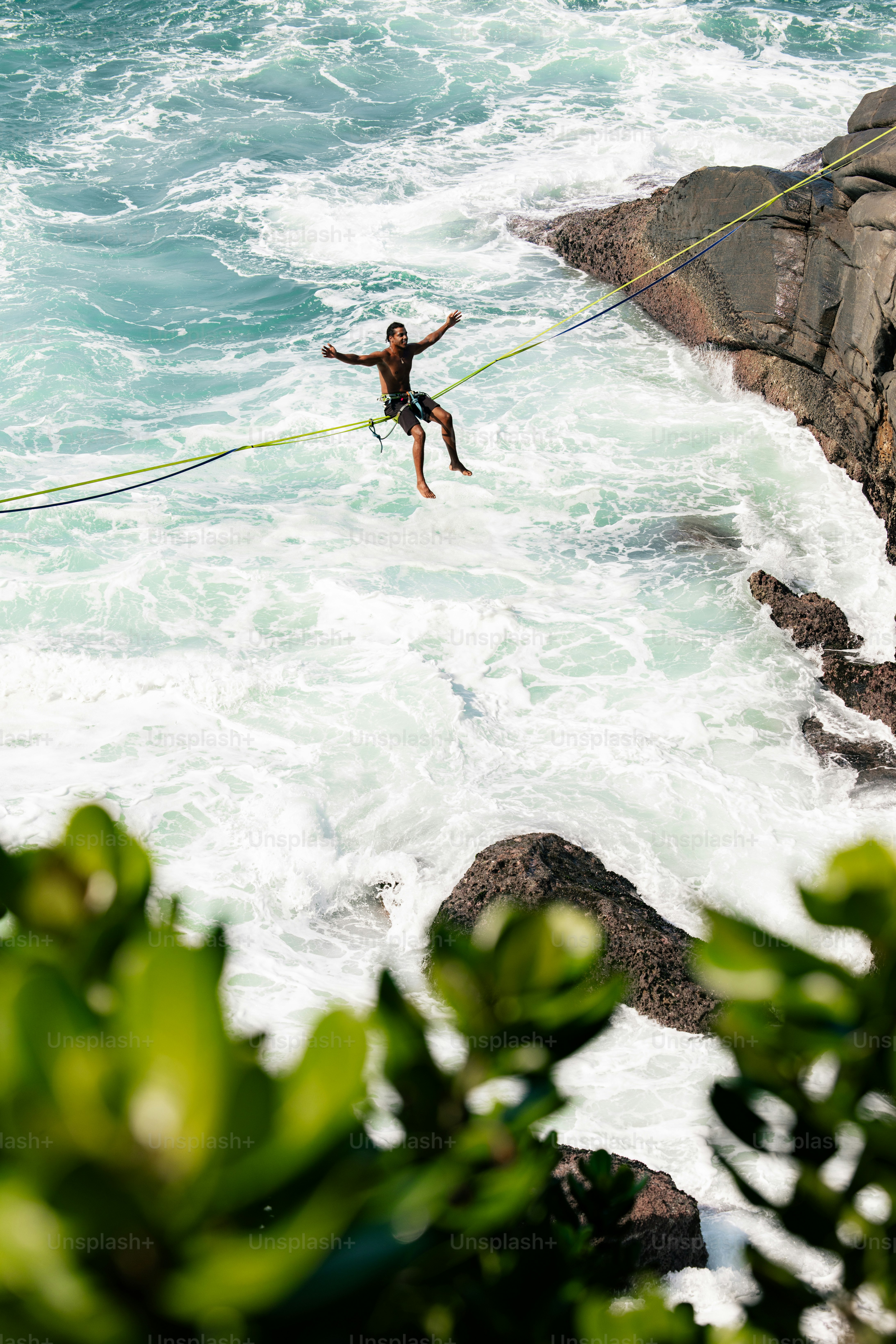 A man on a surfboard being pulled by a rope photo – Agility Image on ...