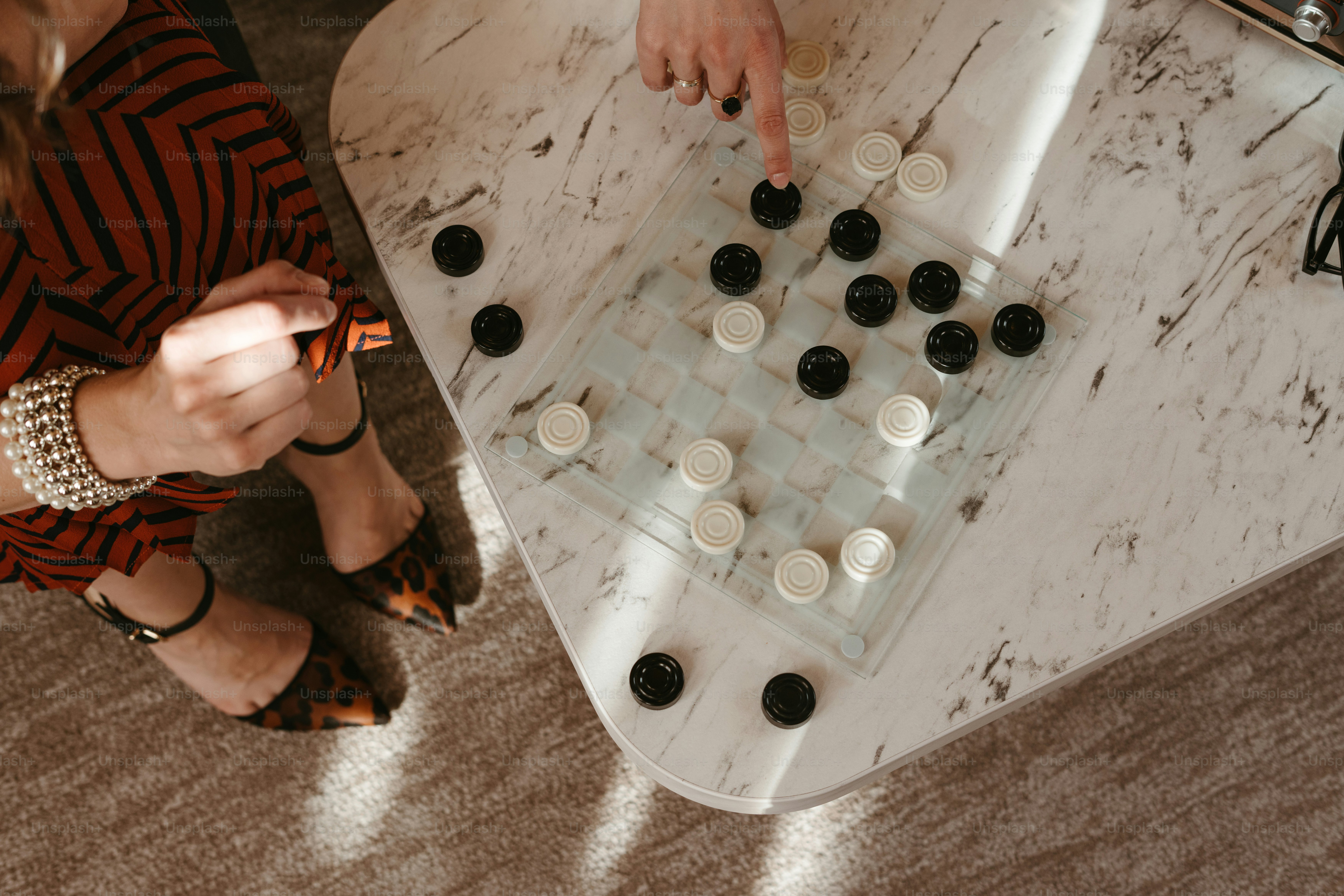A woman is playing a game of checkers photo – Retro aesthetic Image on ...
