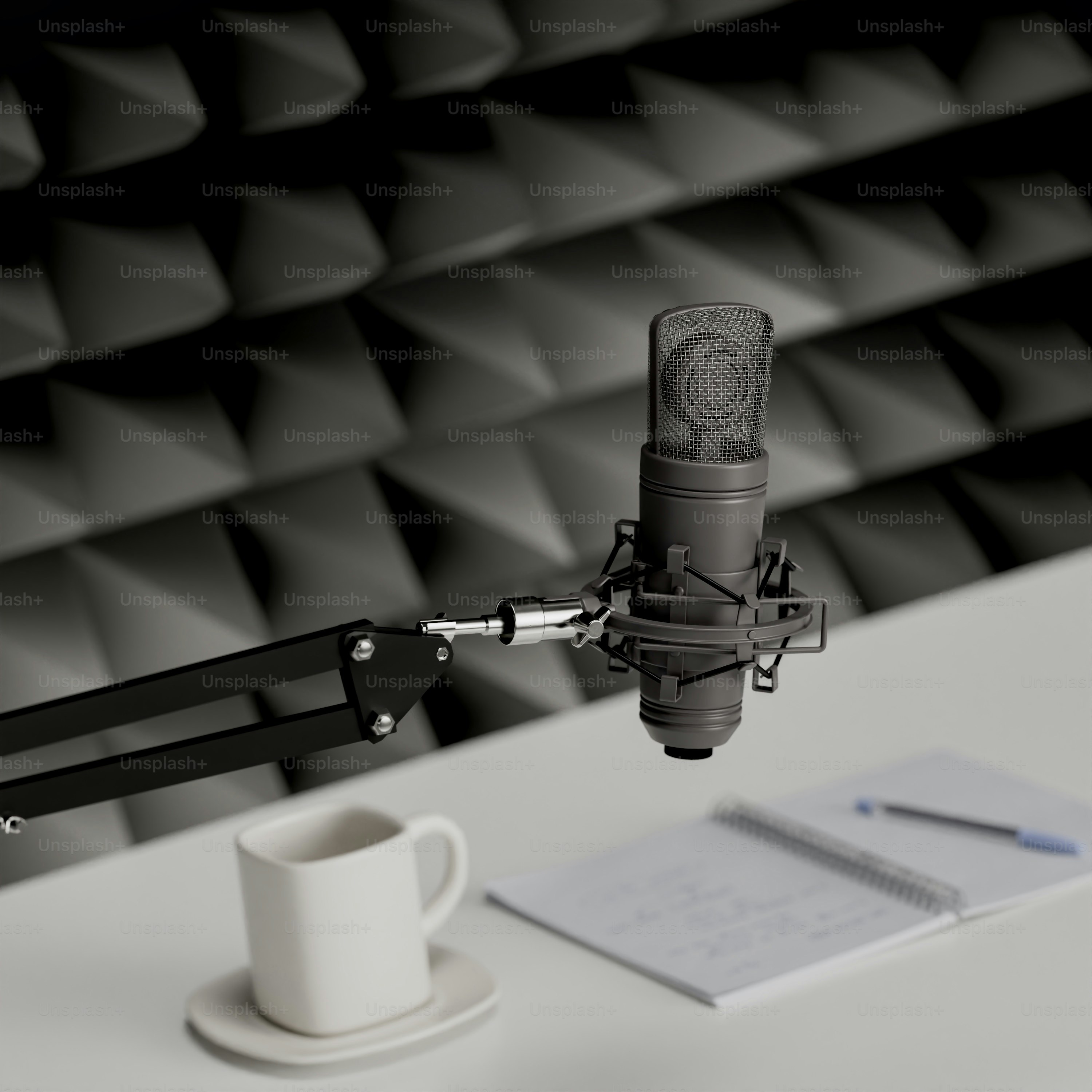 A microphone and a cup on a desk photo – 3d Image on Unsplash