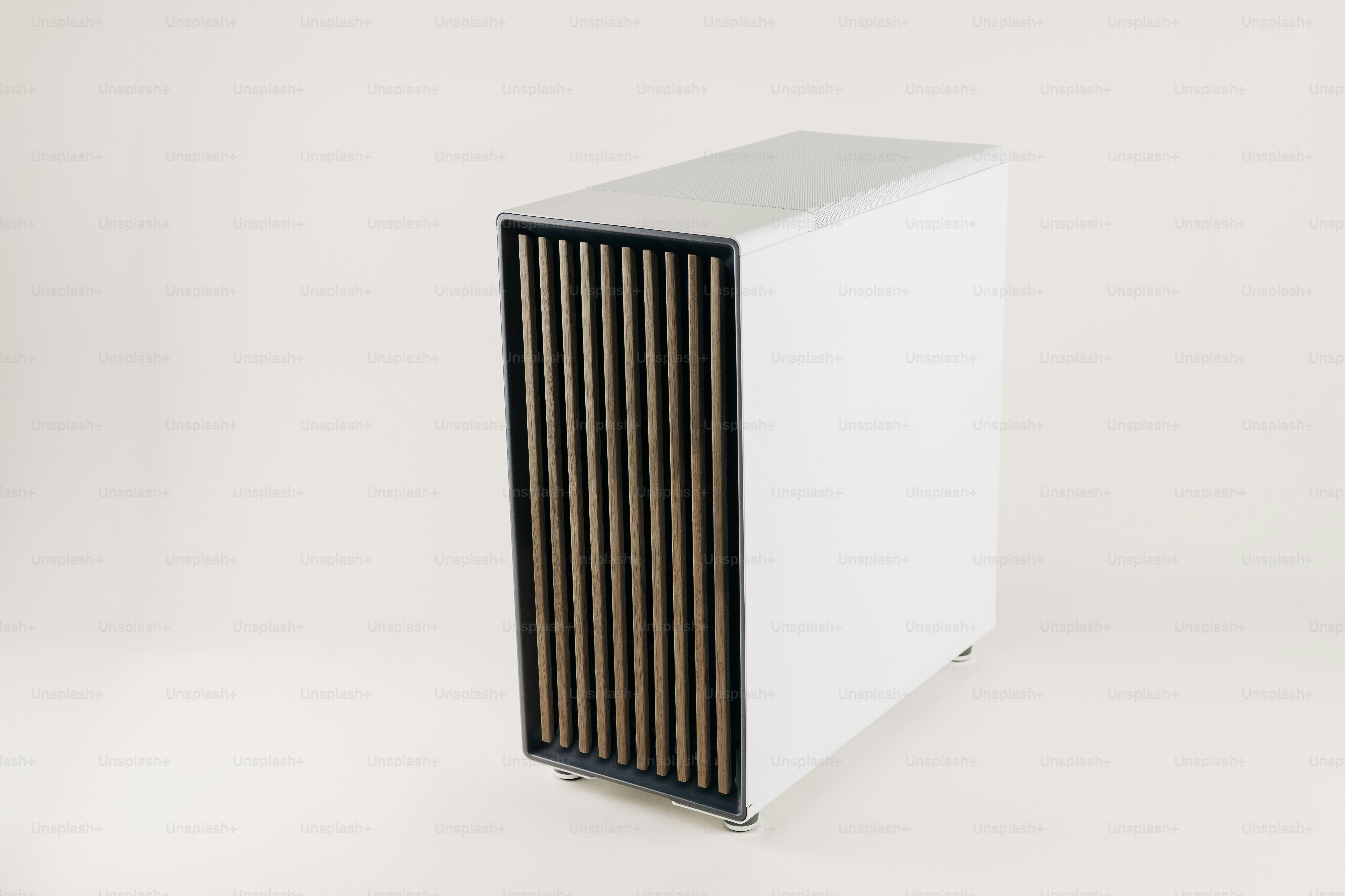 A white and black computer tower on a white background photo – Hardware ...