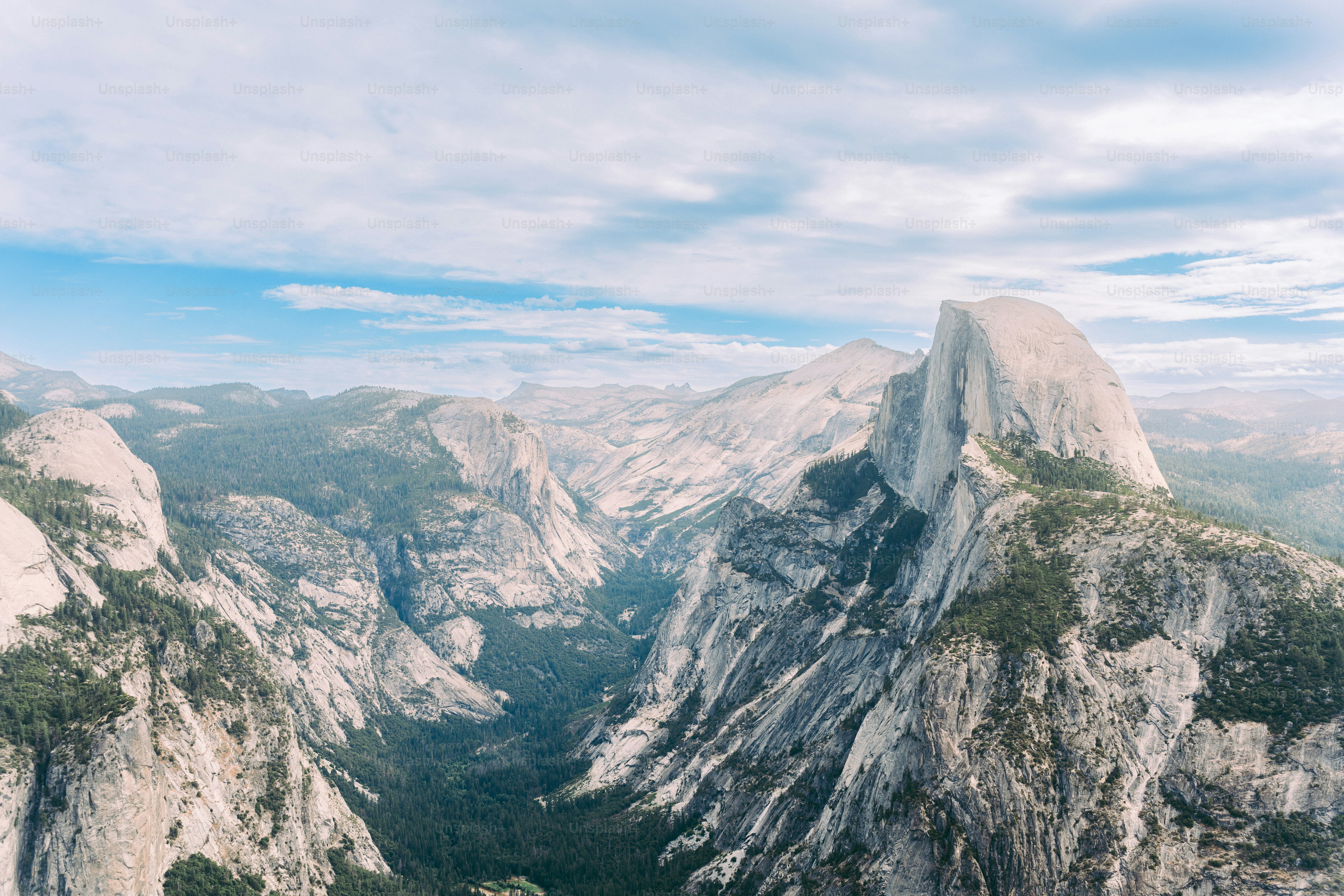 A view of the mountains from the top of a mountain photo – Yosemite ...