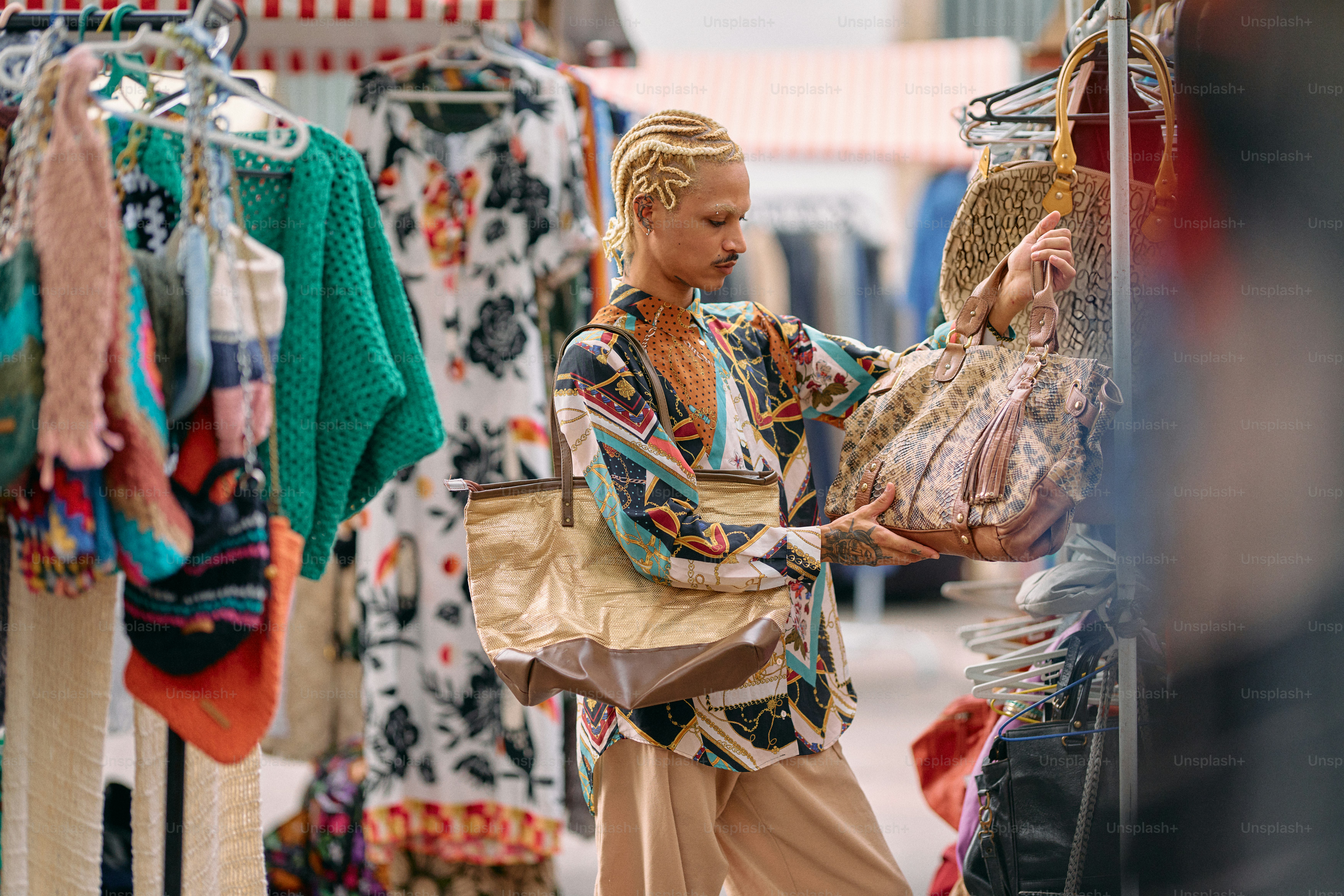 A woman standing in front of a rack of clothes photo – Streetwear Image ...