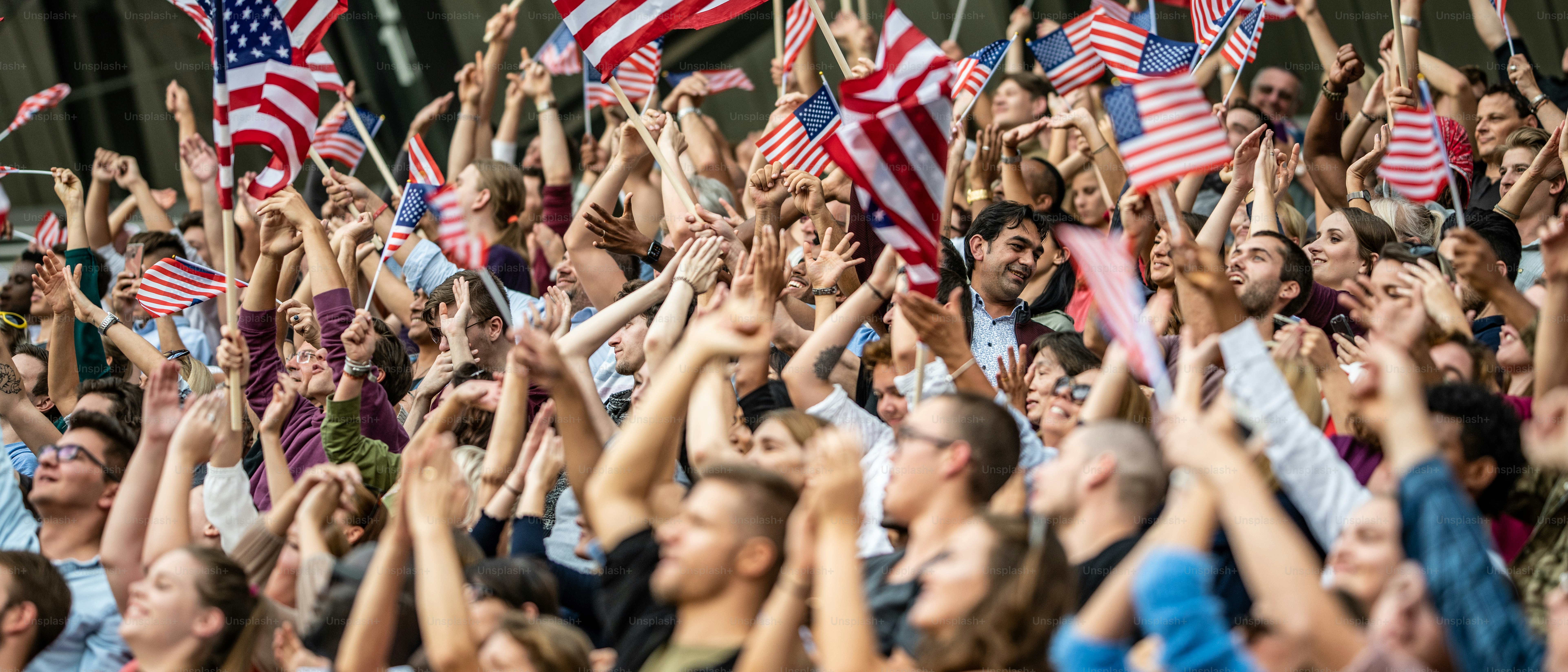 Excited American fans cheering for their team at the Olympic games ...