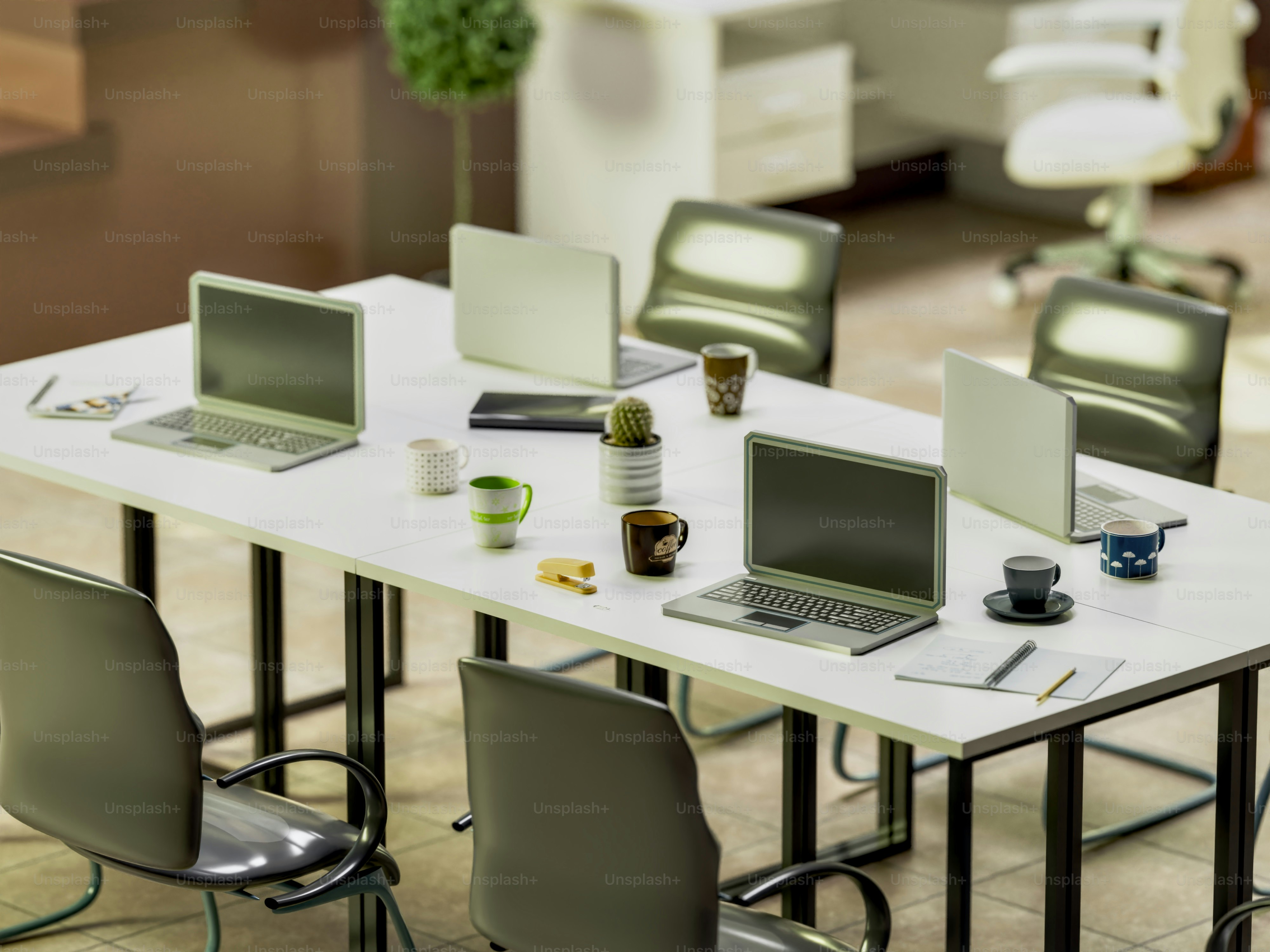 A long table with four laptops on it photo – Coworking space Image on ...