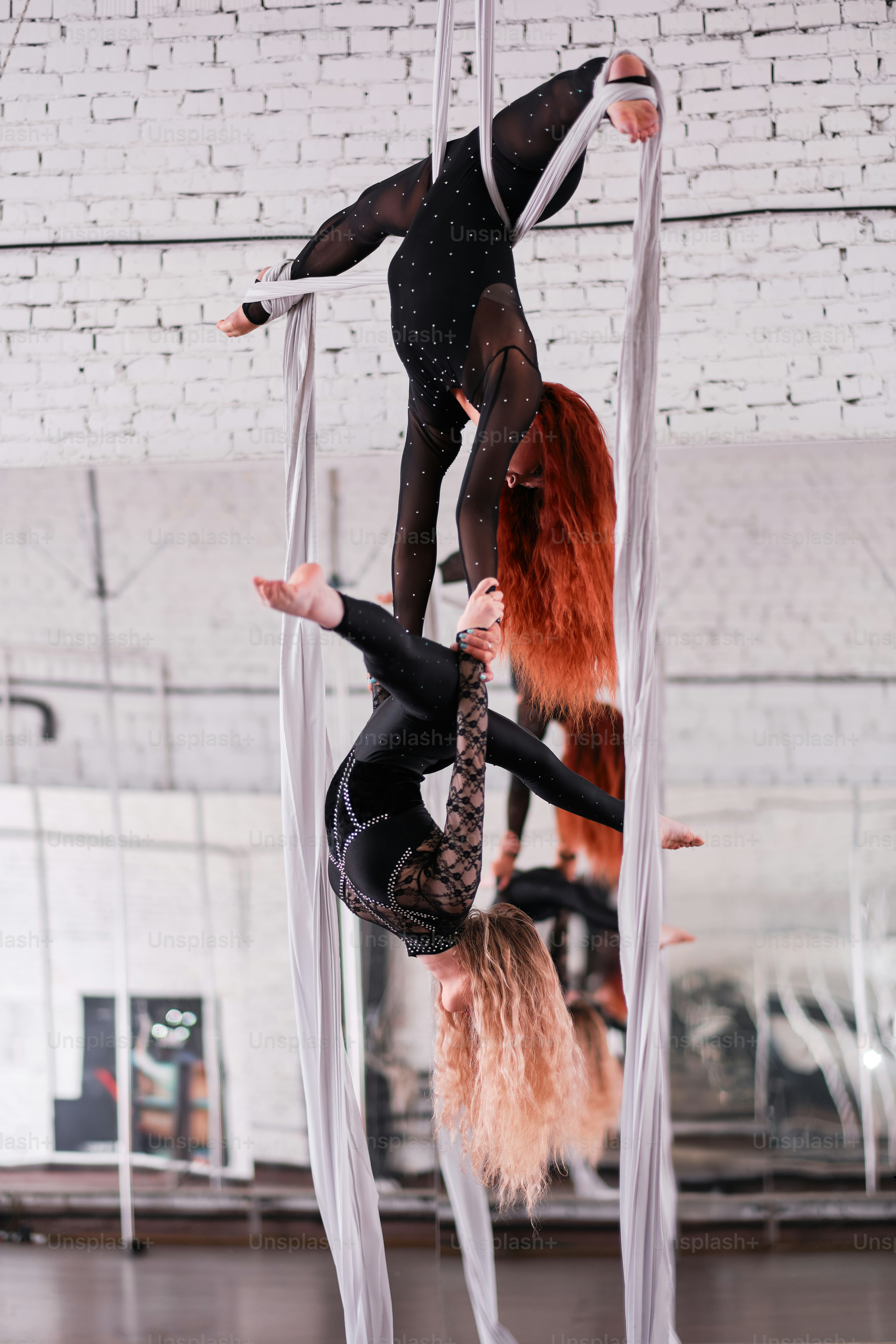 Two acrobatic acrobatic performers performing aerial acrobatics photo ...