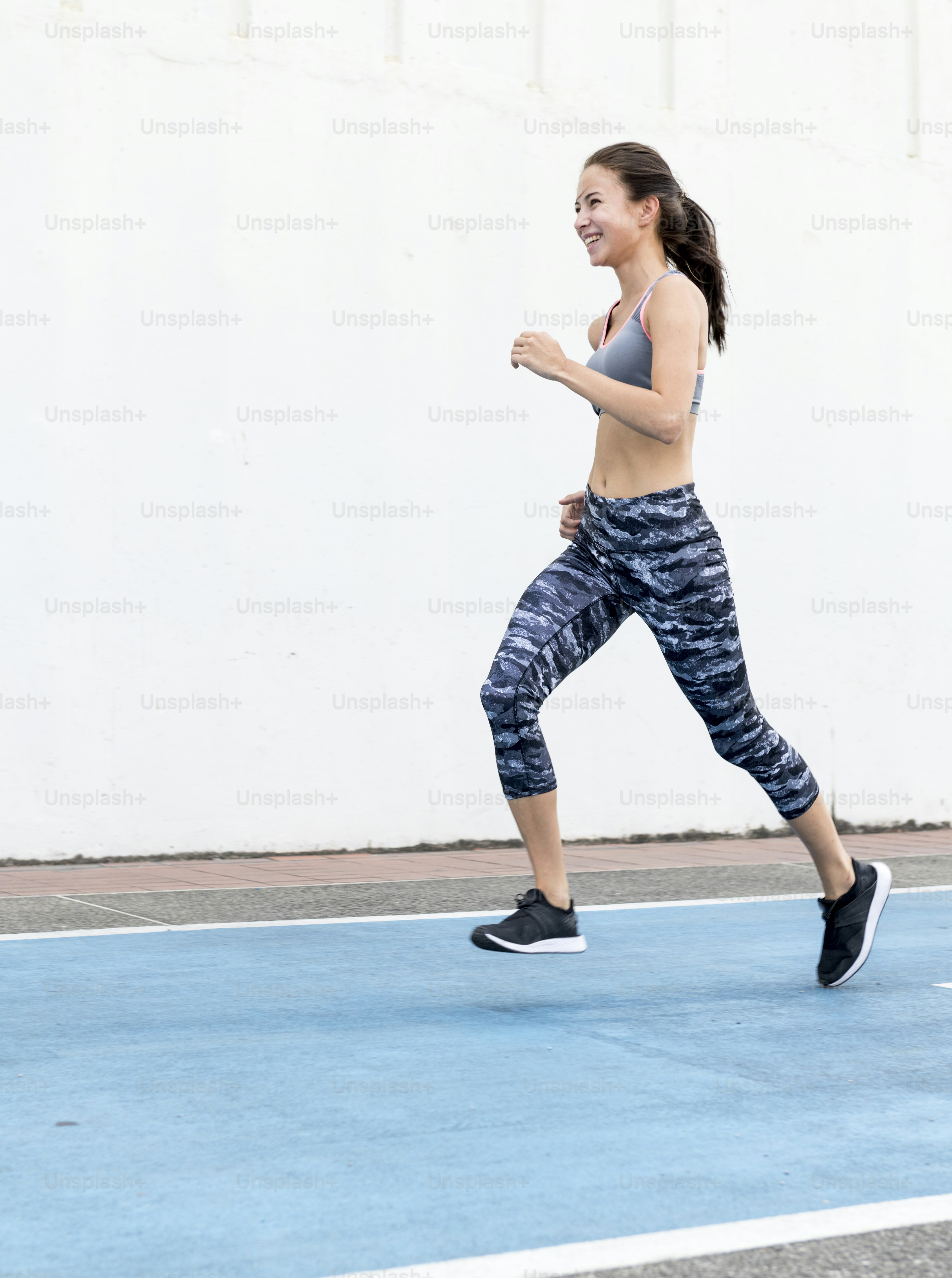 White woman running on track photo – Active lifestyle Image on Unsplash