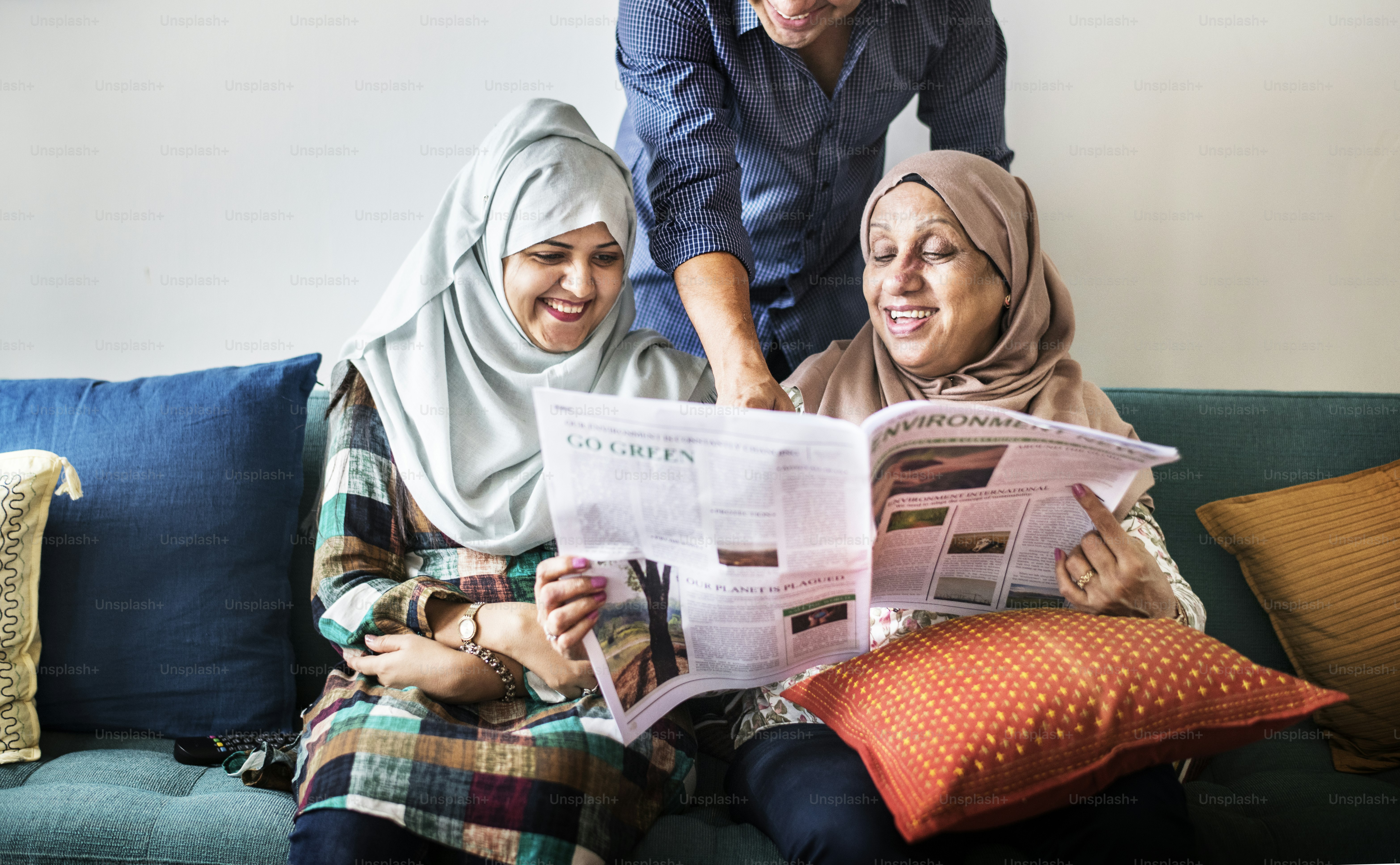 Muslim family reading the news ***These documents are our own generic ...