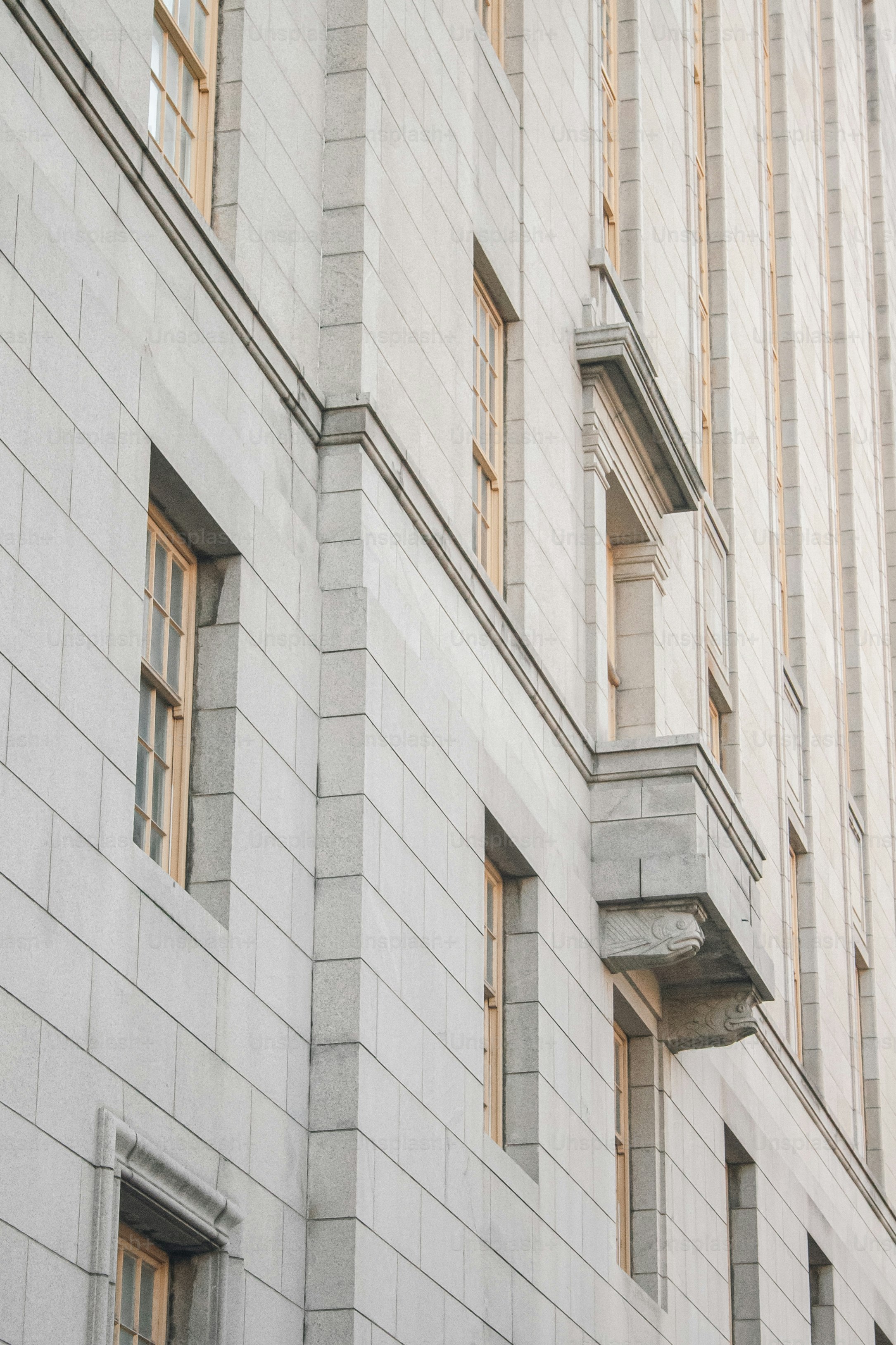 A stop sign in front of a tall building photo – Architecture Image on ...