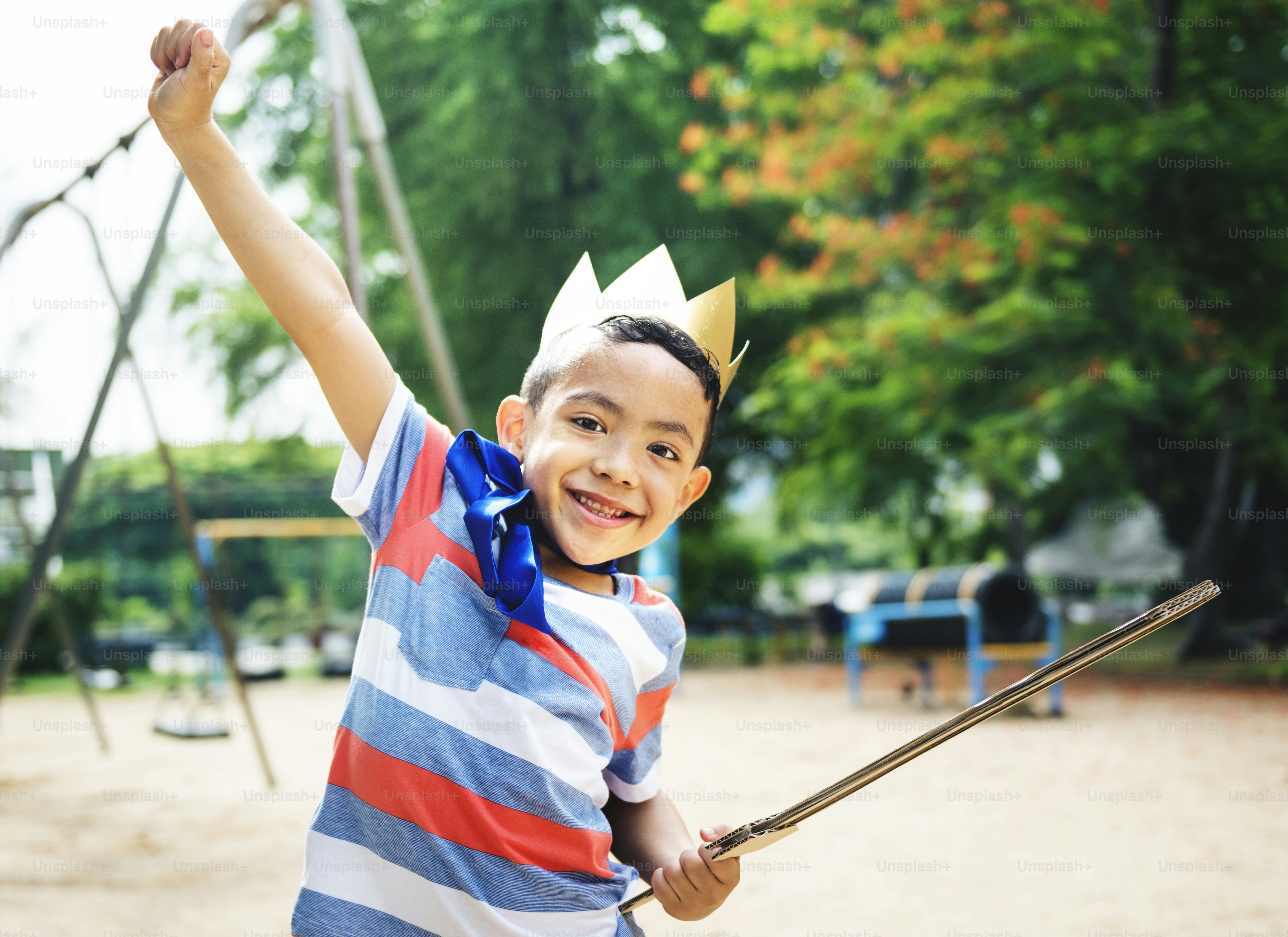Boy playing king at a playground photo – Playground Image on Unsplash