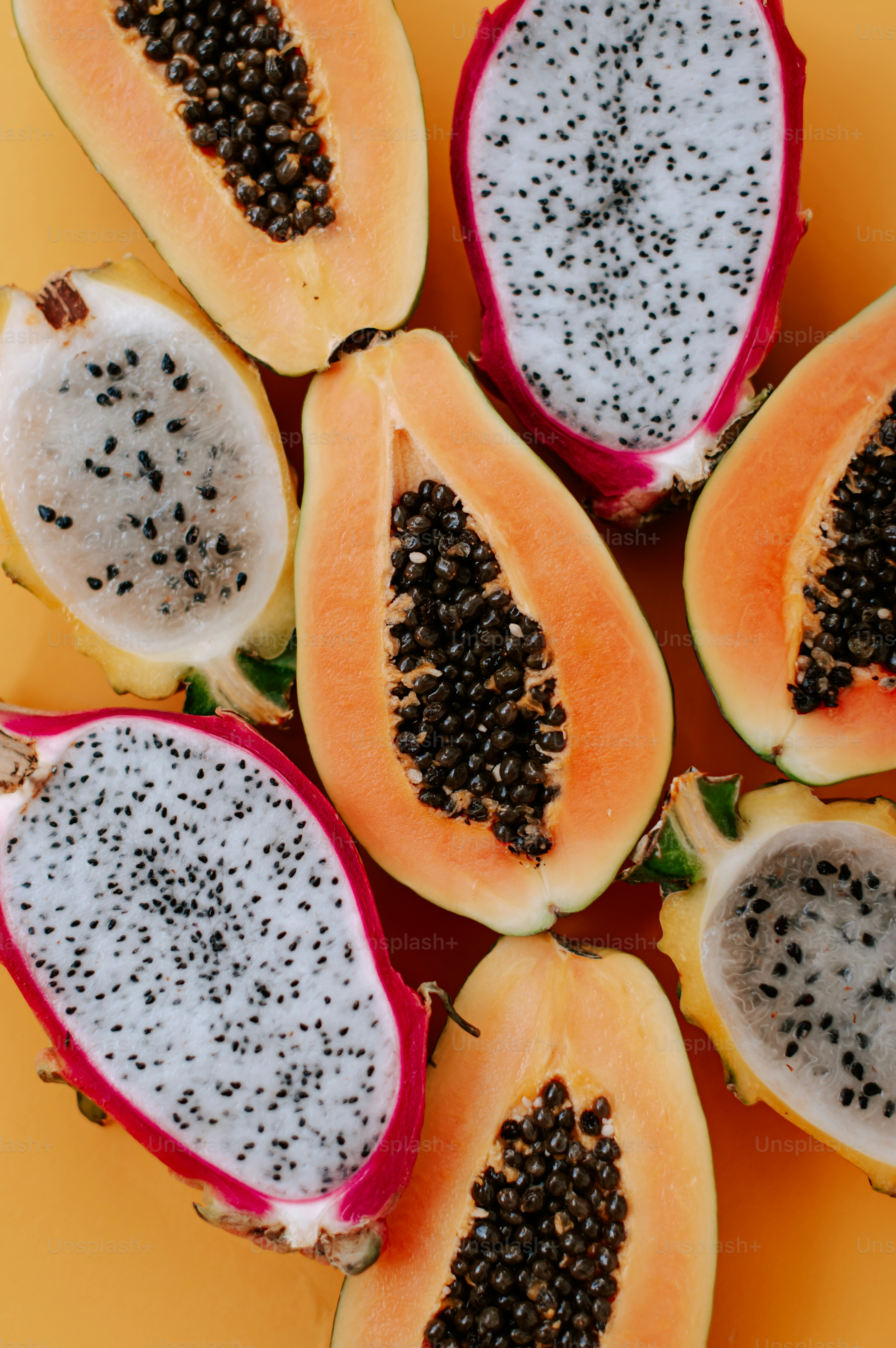 A bunch of cut up fruit sitting on top of a table photo – Dragon fruit ...