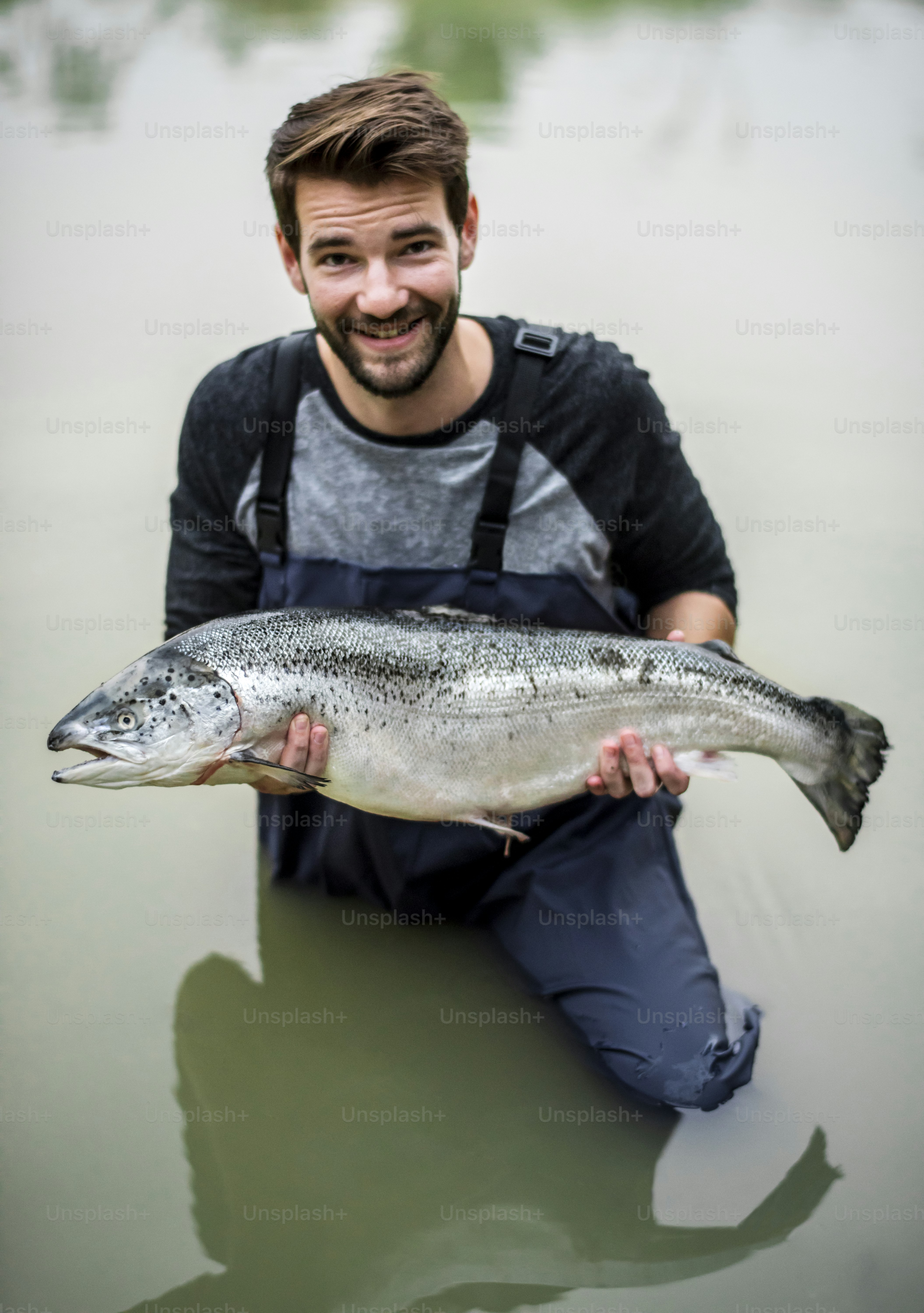 Man caught salmon fish photo – Freshwater fishing Image on Unsplash