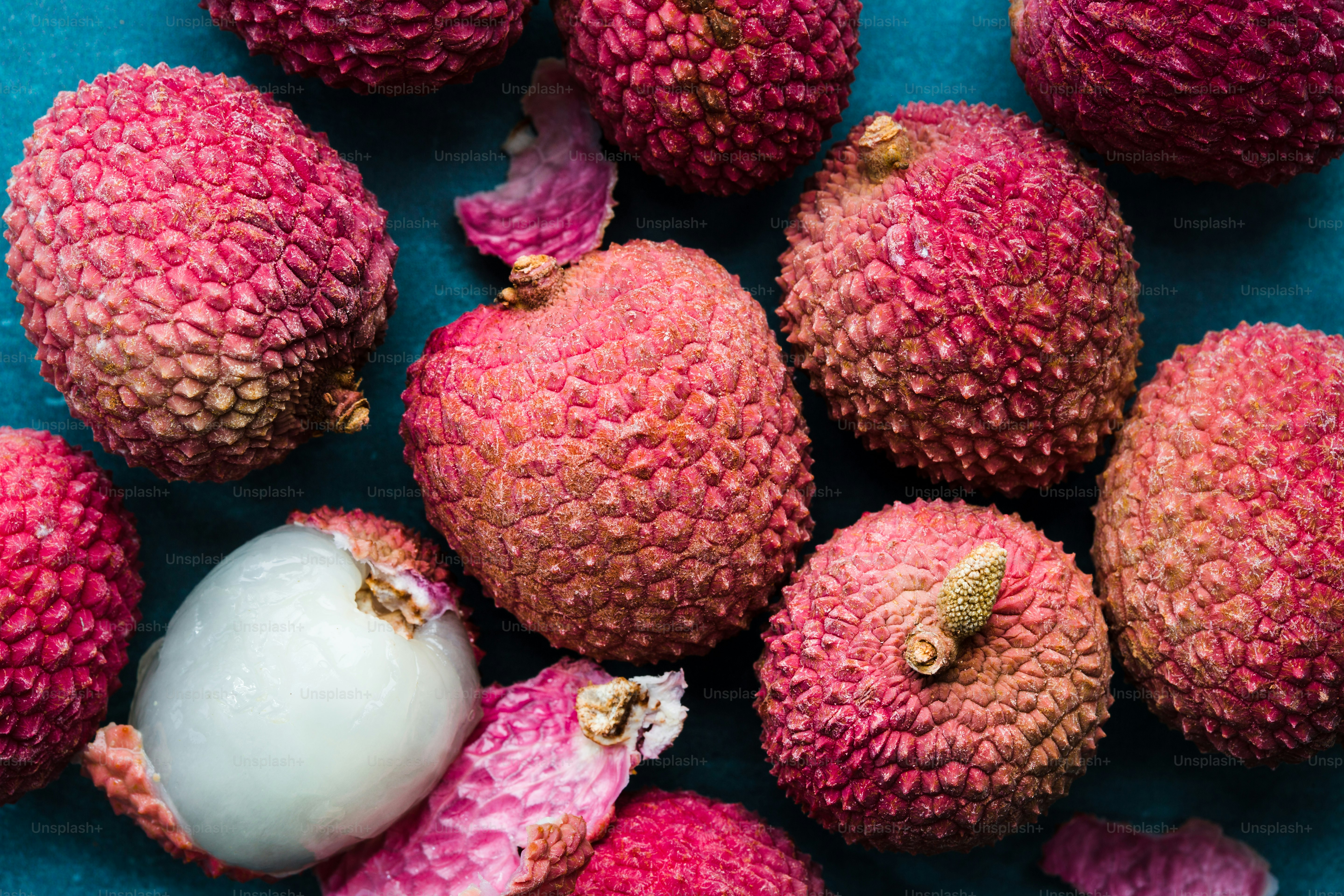 A bunch of fruit sitting on top of a blue table photo – Fruit Image on ...