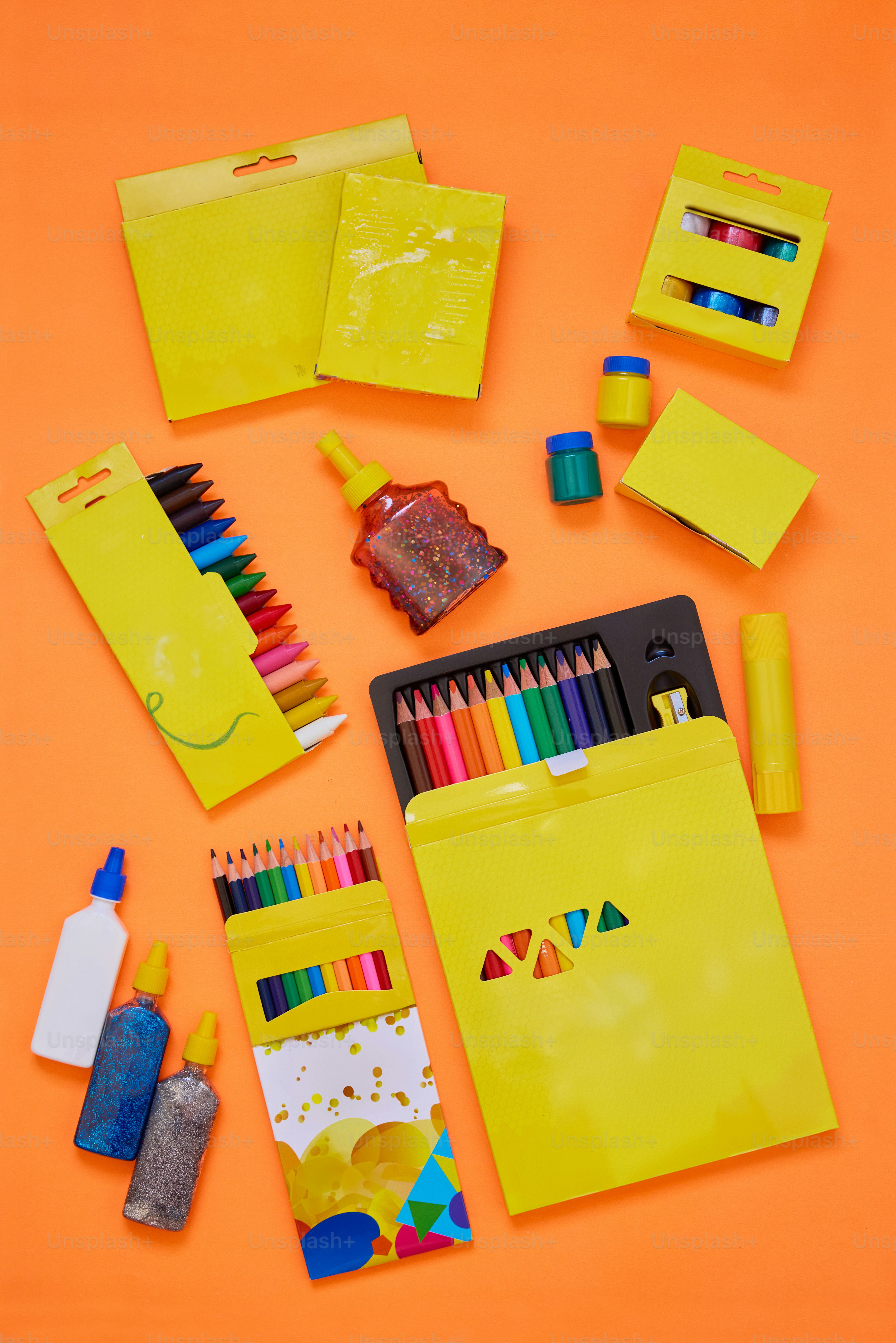 A bunch of school supplies on an orange background photo – Image on ...