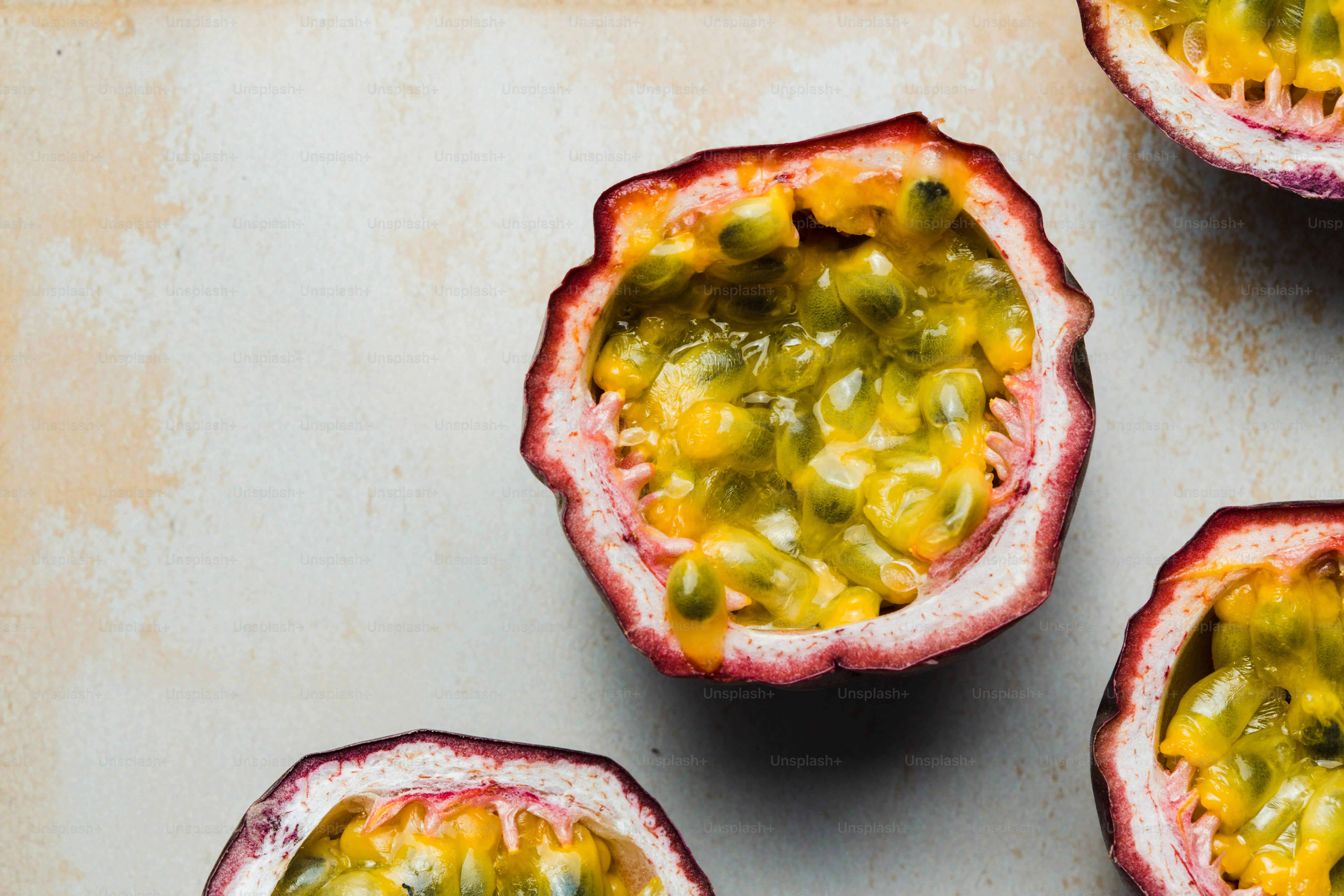 A table topped with cut open fruit on top of a pan photo – Food Image ...