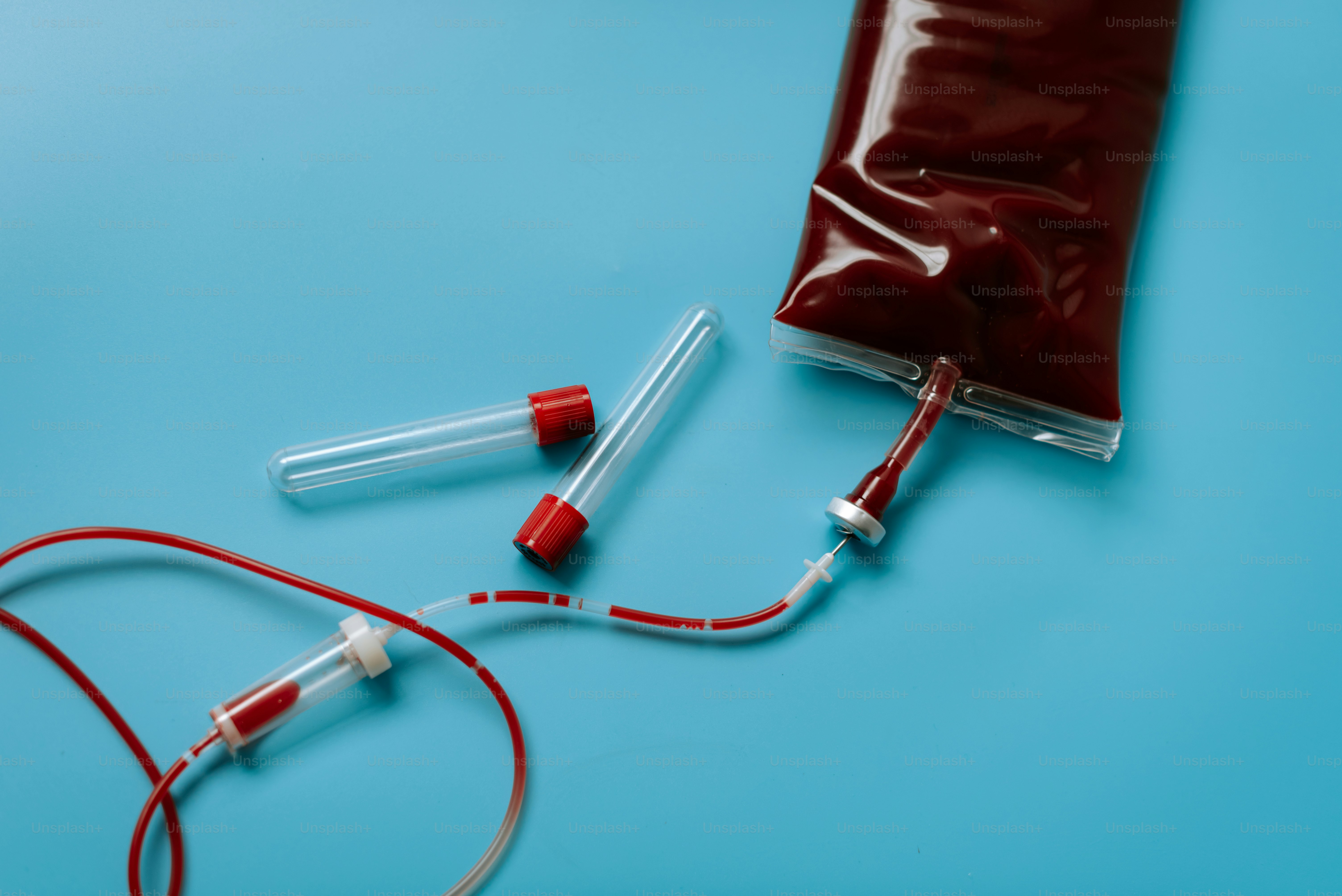 A blood bag with two tubes attached to it photo – Blood Image on Unsplash