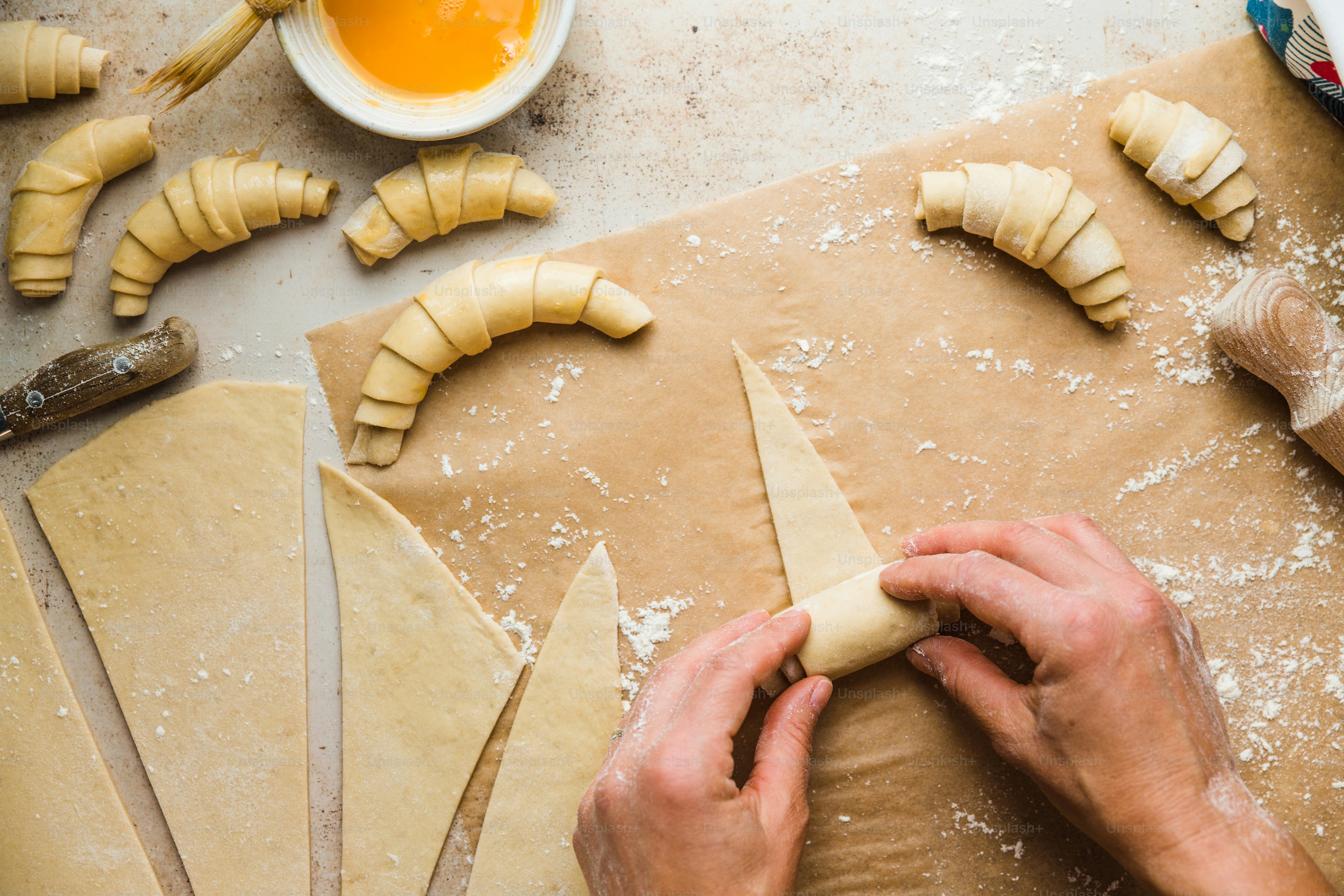 A person is making some food on a table photo – Cooking Image on Unsplash