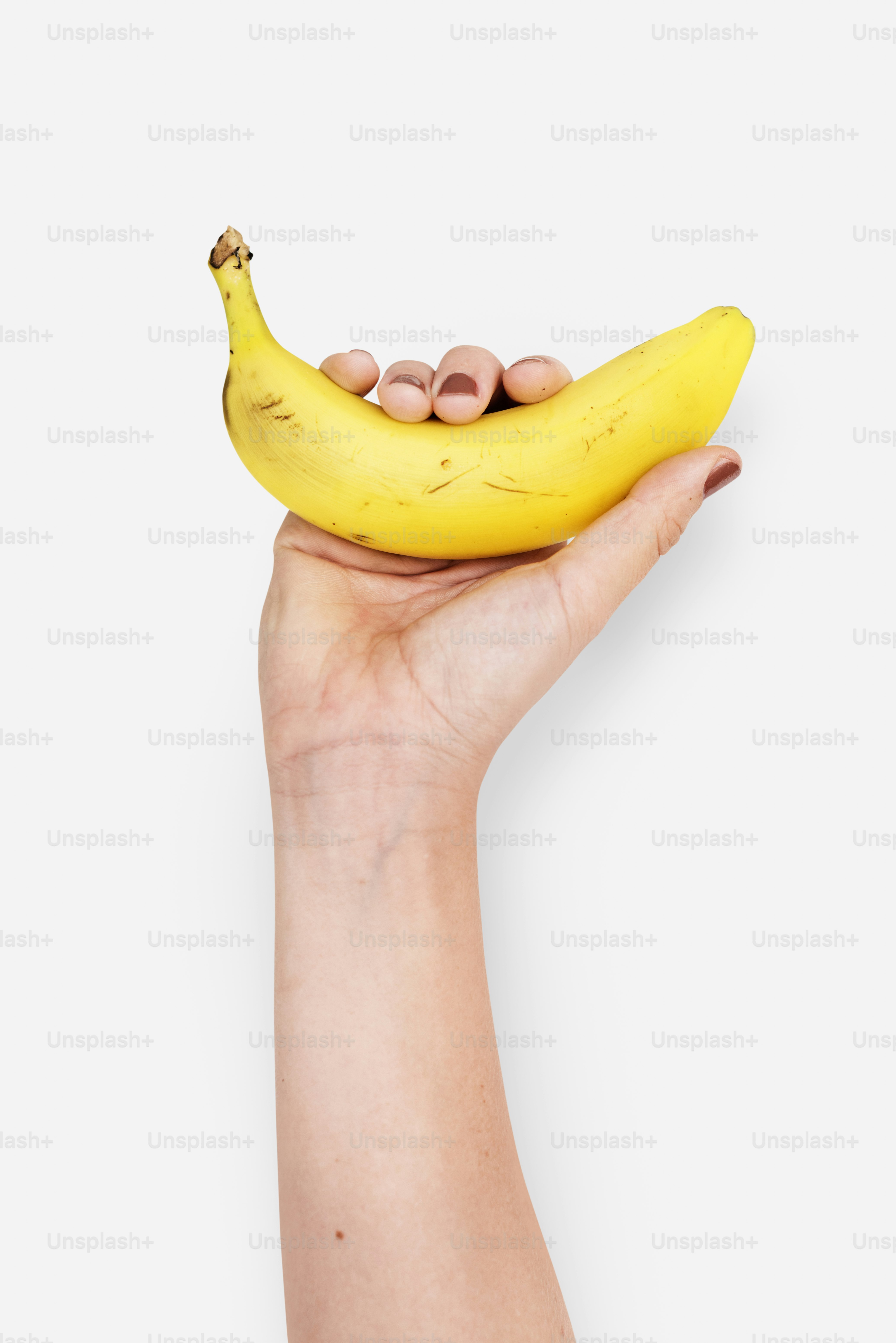 Human Hand Holding Banana Fruit Nutrition Concept photo – Banana Image ...