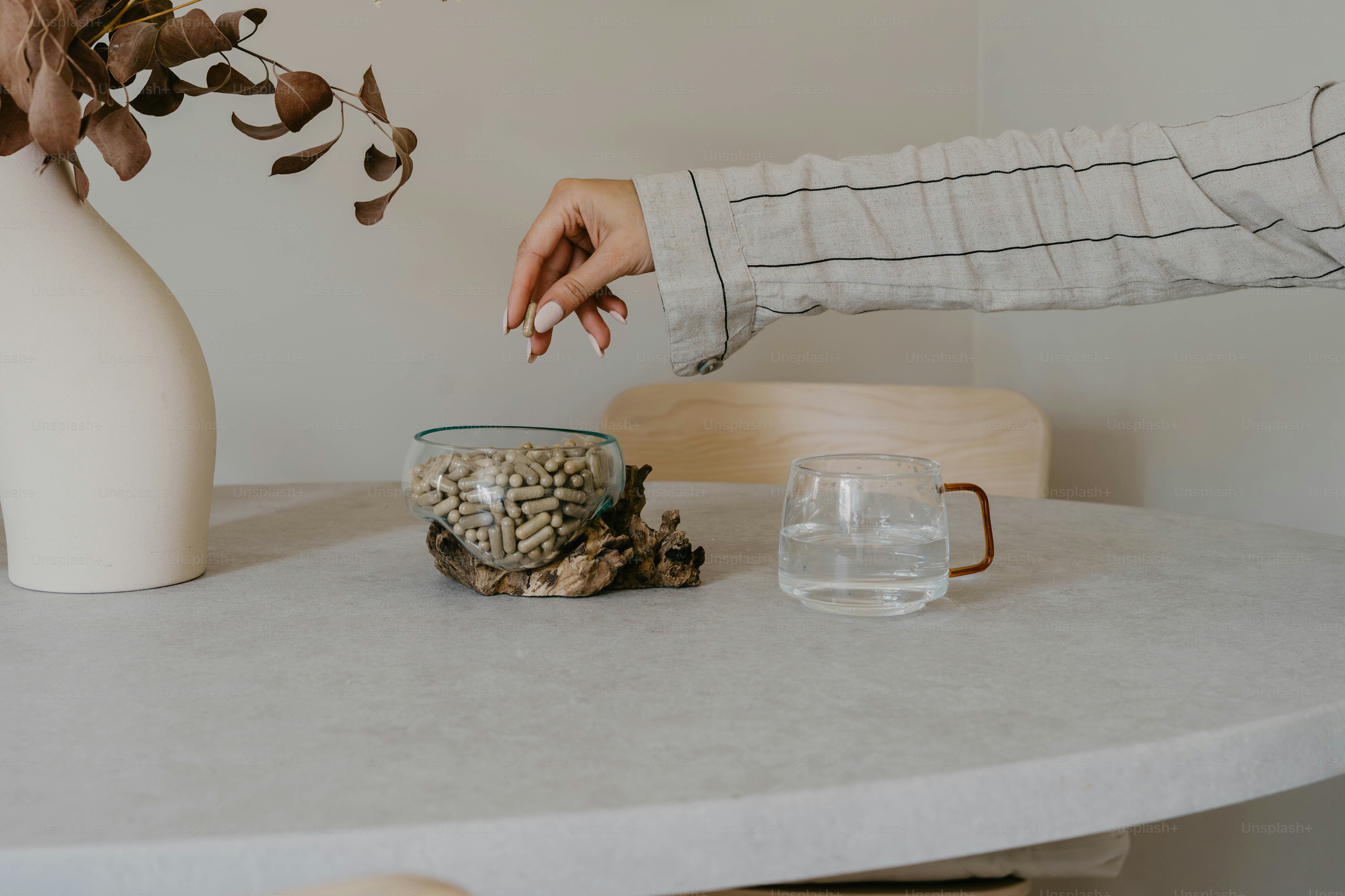 A person reaching for something on a table photo – Neutral aesthetic ...