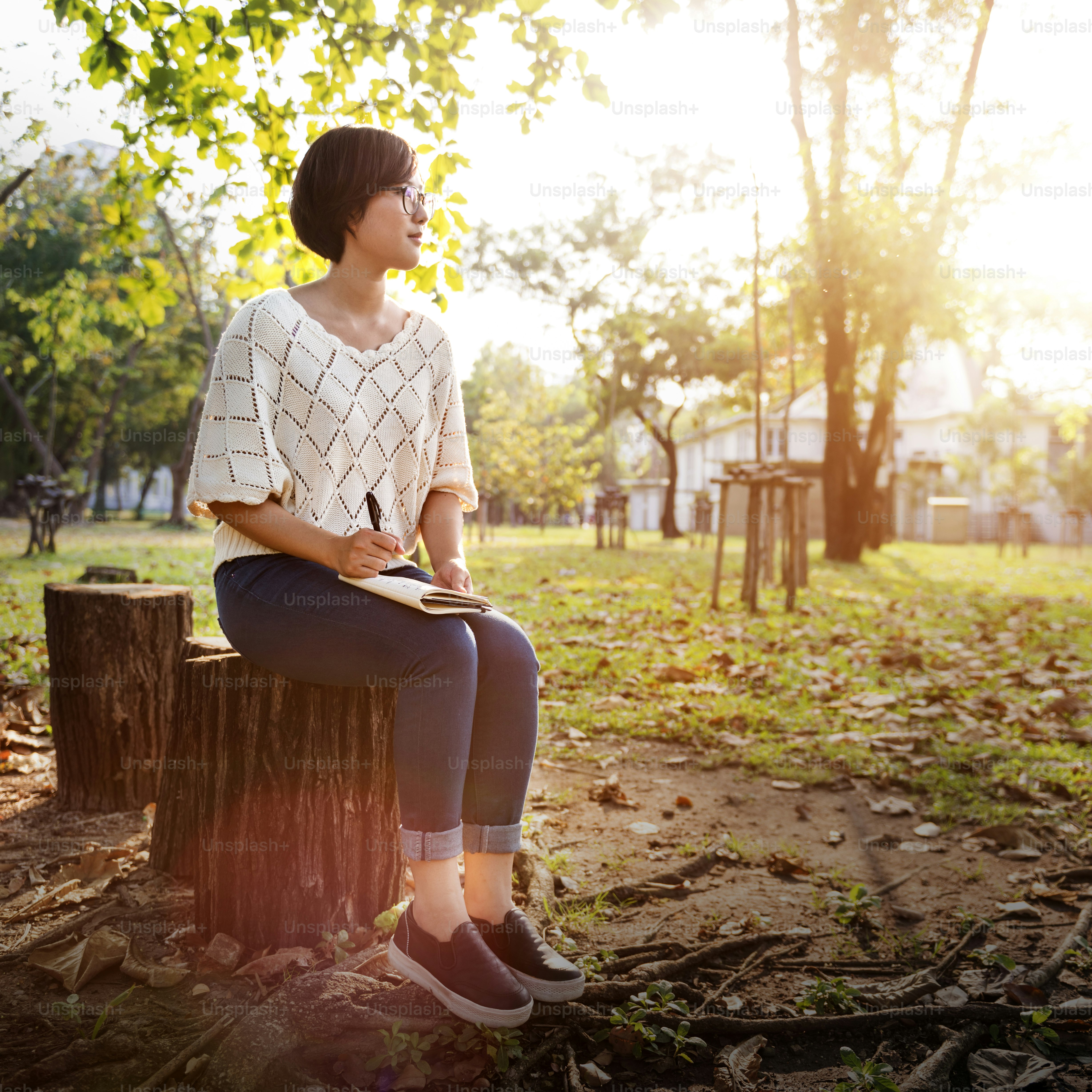 Young Woman Sitting Writing Outside Concept photo – Grass Image on Unsplash