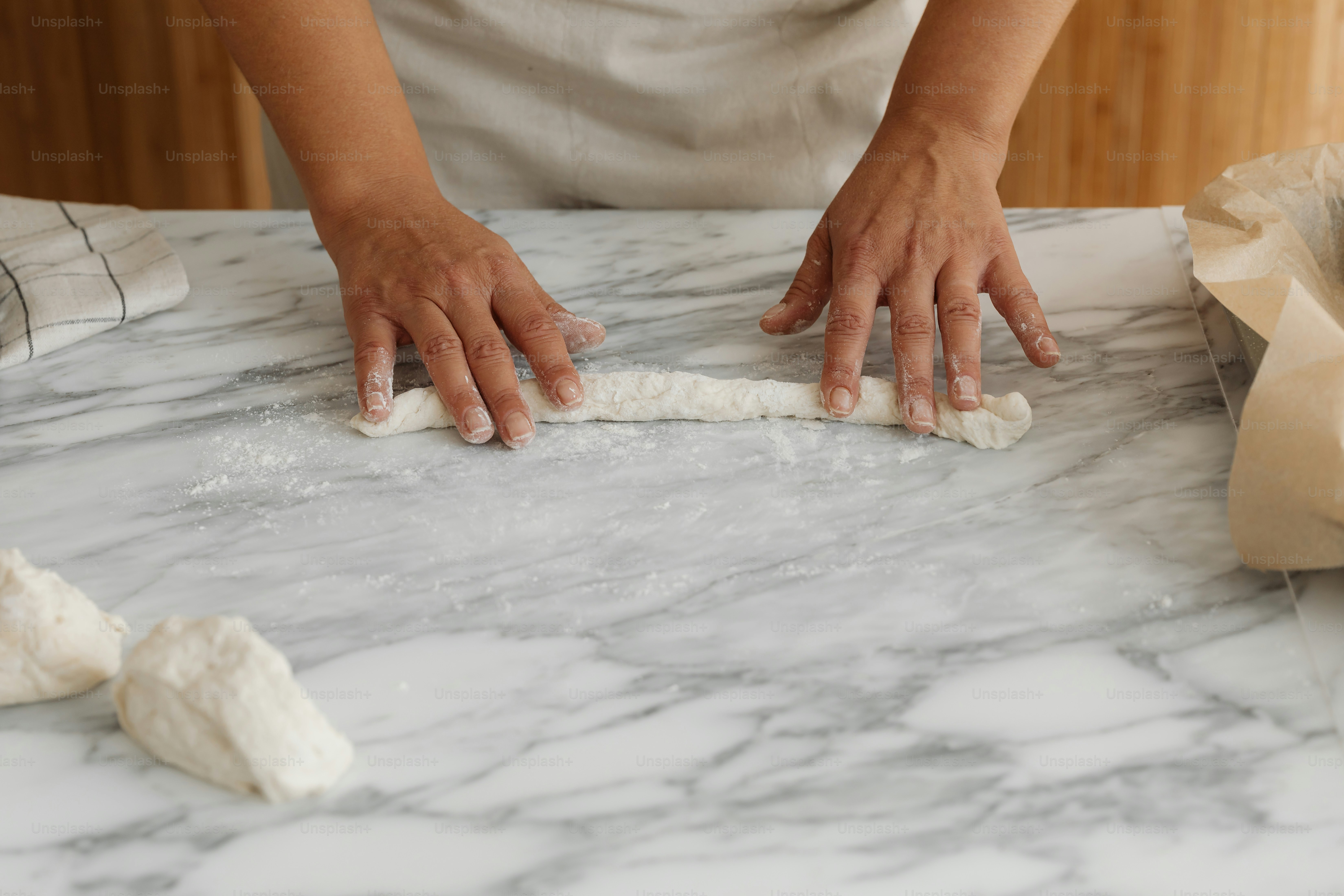A person kneading dough on top of a table photo – Cooking Image on Unsplash