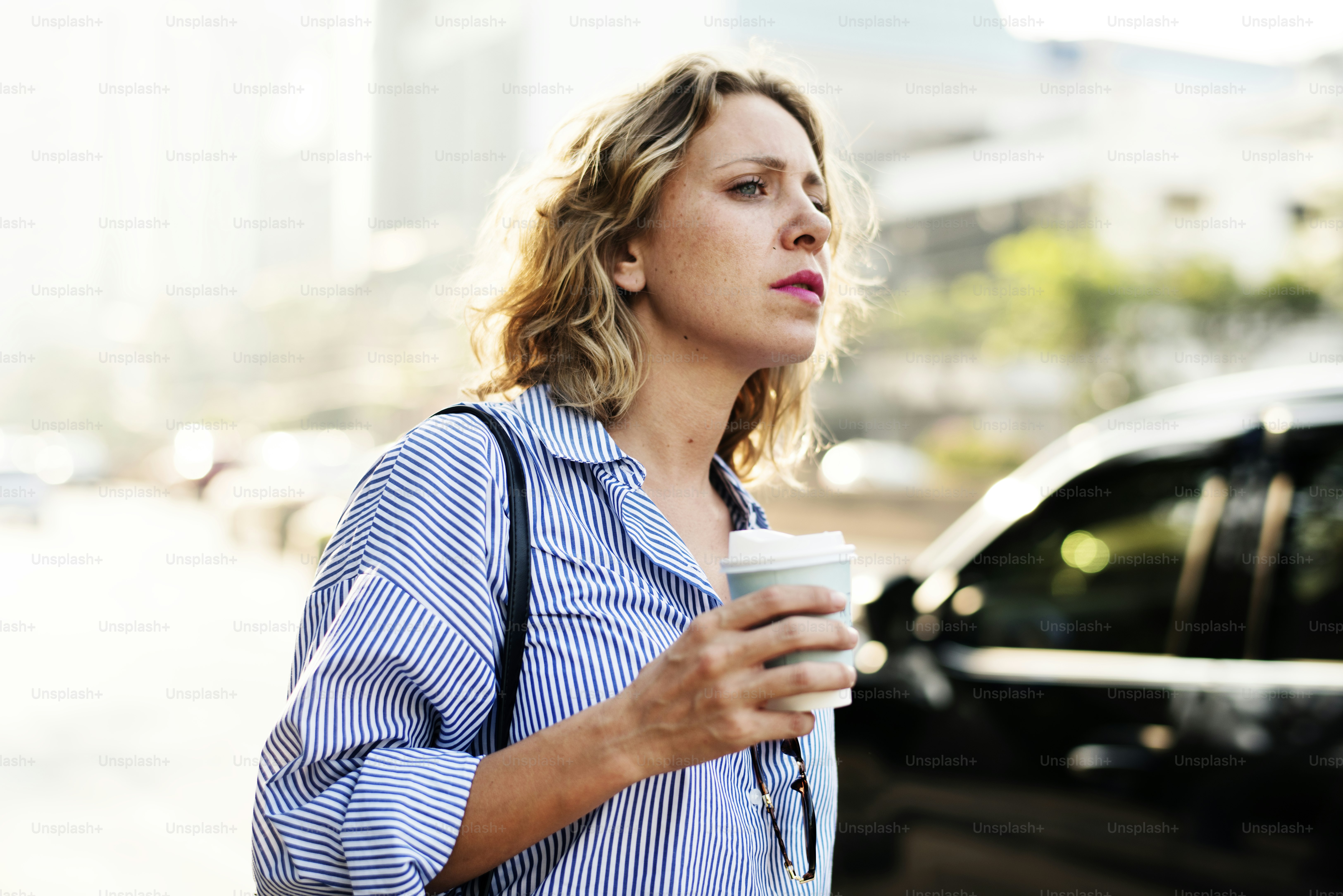 Woman on the wait for cab photo – Coffee cup Image on Unsplash