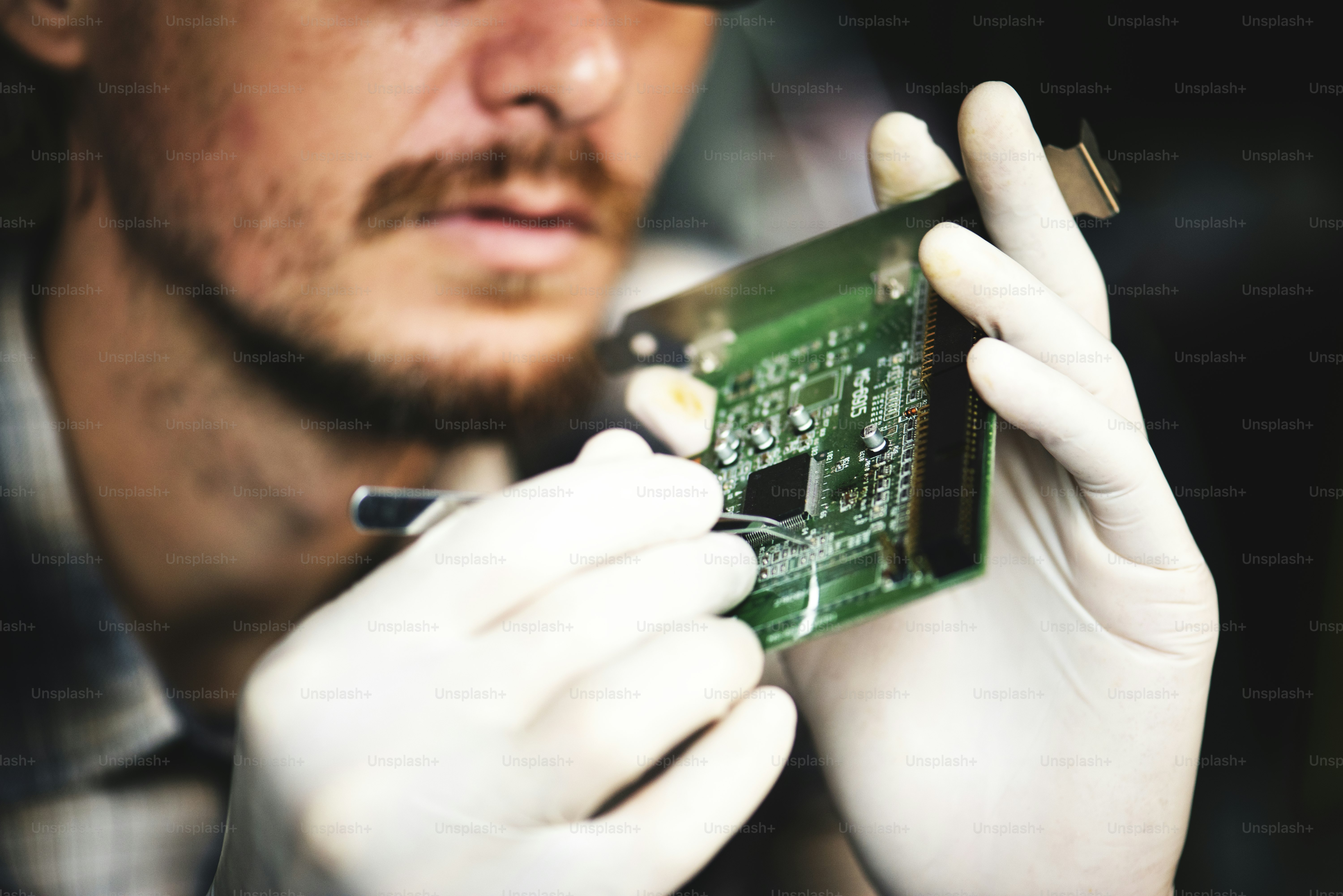 Closeup of hands with computer mainboard microprocessor electronics ...