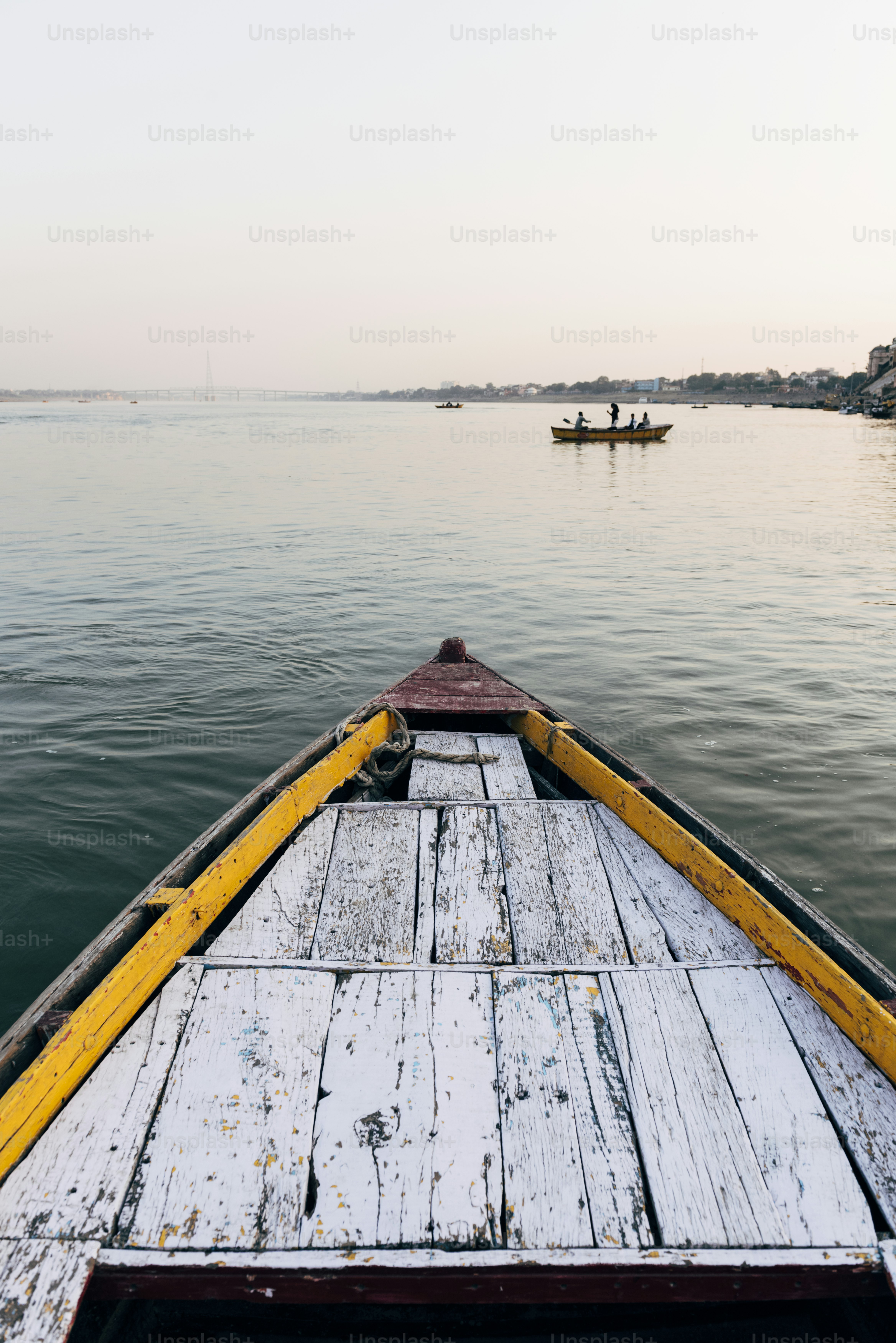 Wooden boat sailing on the River Ganges in Varanasi, India photo ...