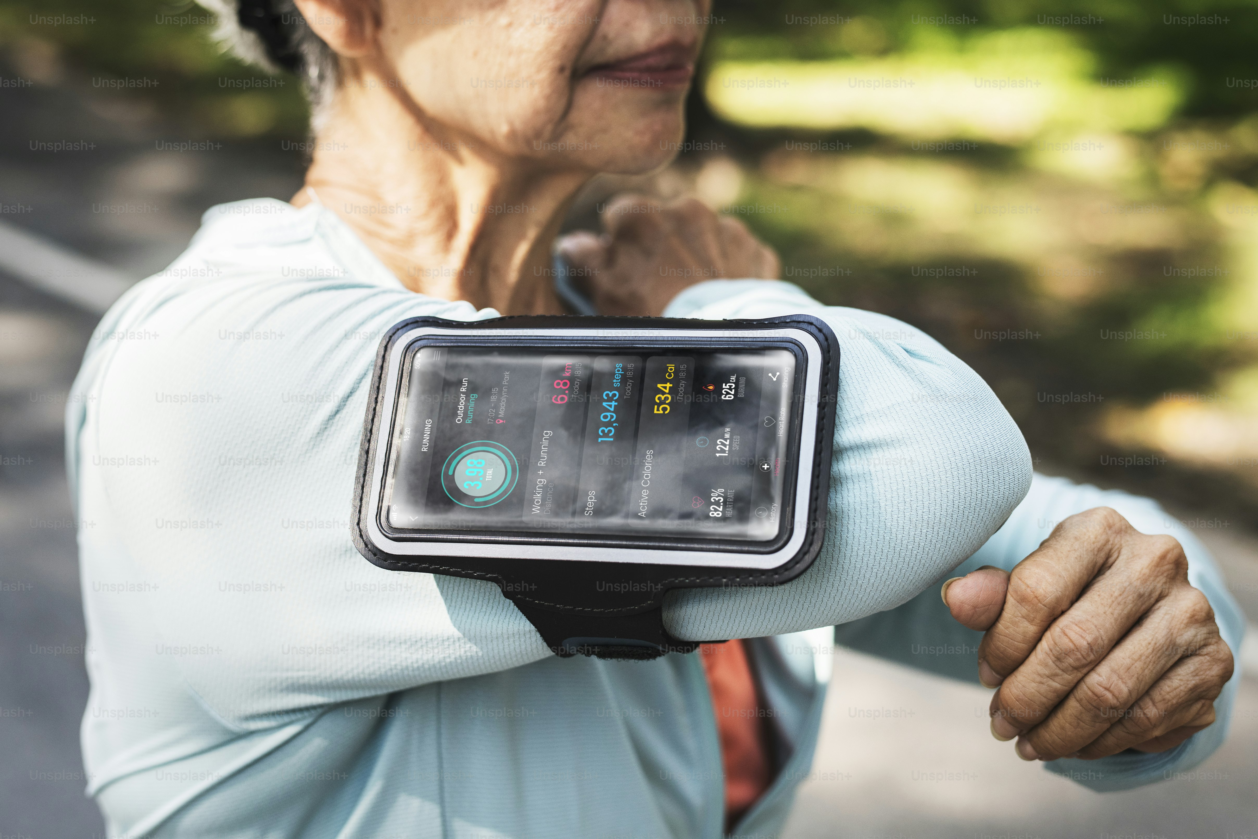 Senior runner using a fitness tracker photo – Limb - body part Image on ...