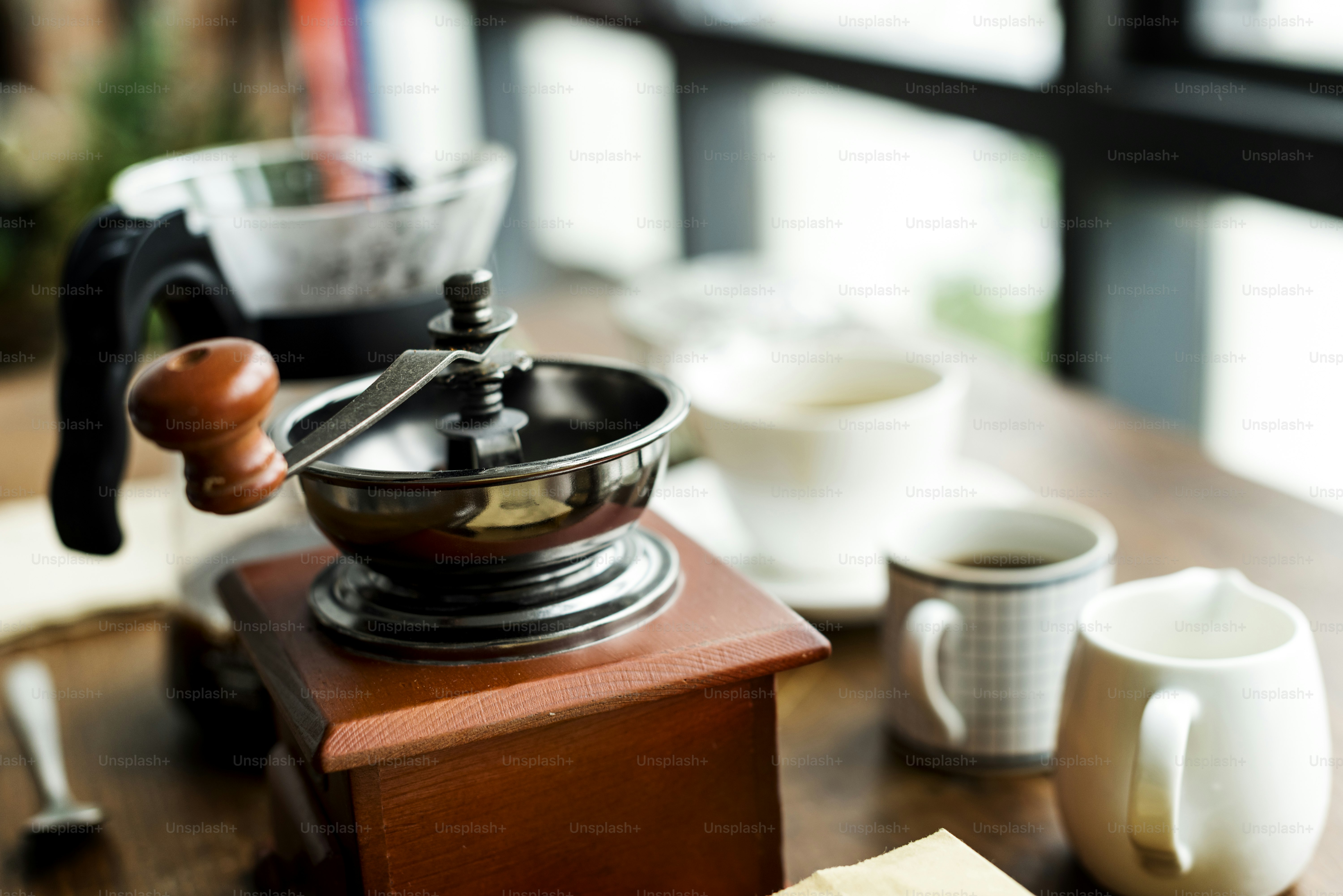 Closeup of coffee grinder on wooden table photo – Photography Image on ...
