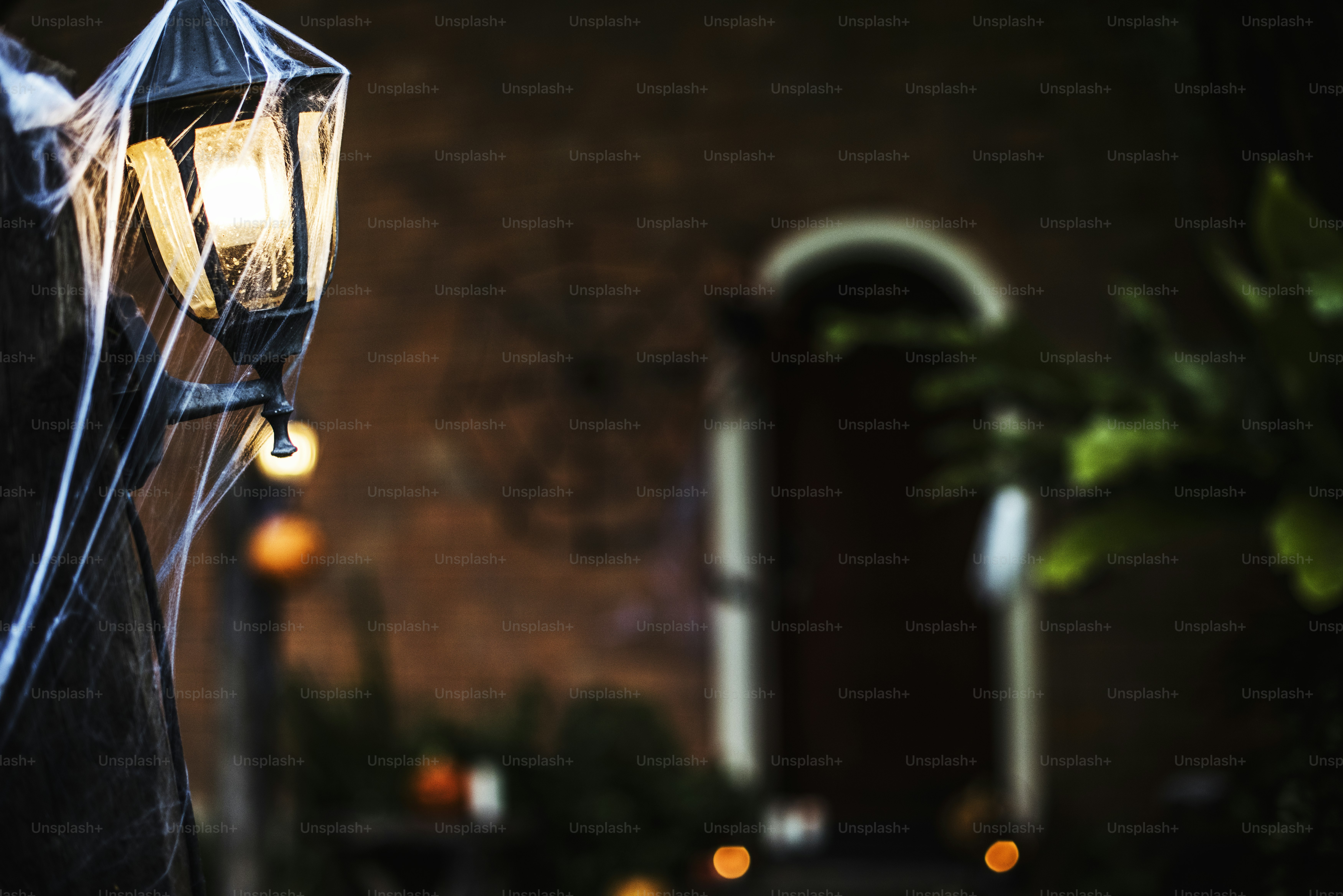 Light post with spiderweb on Halloween photo – Electricity Image on ...