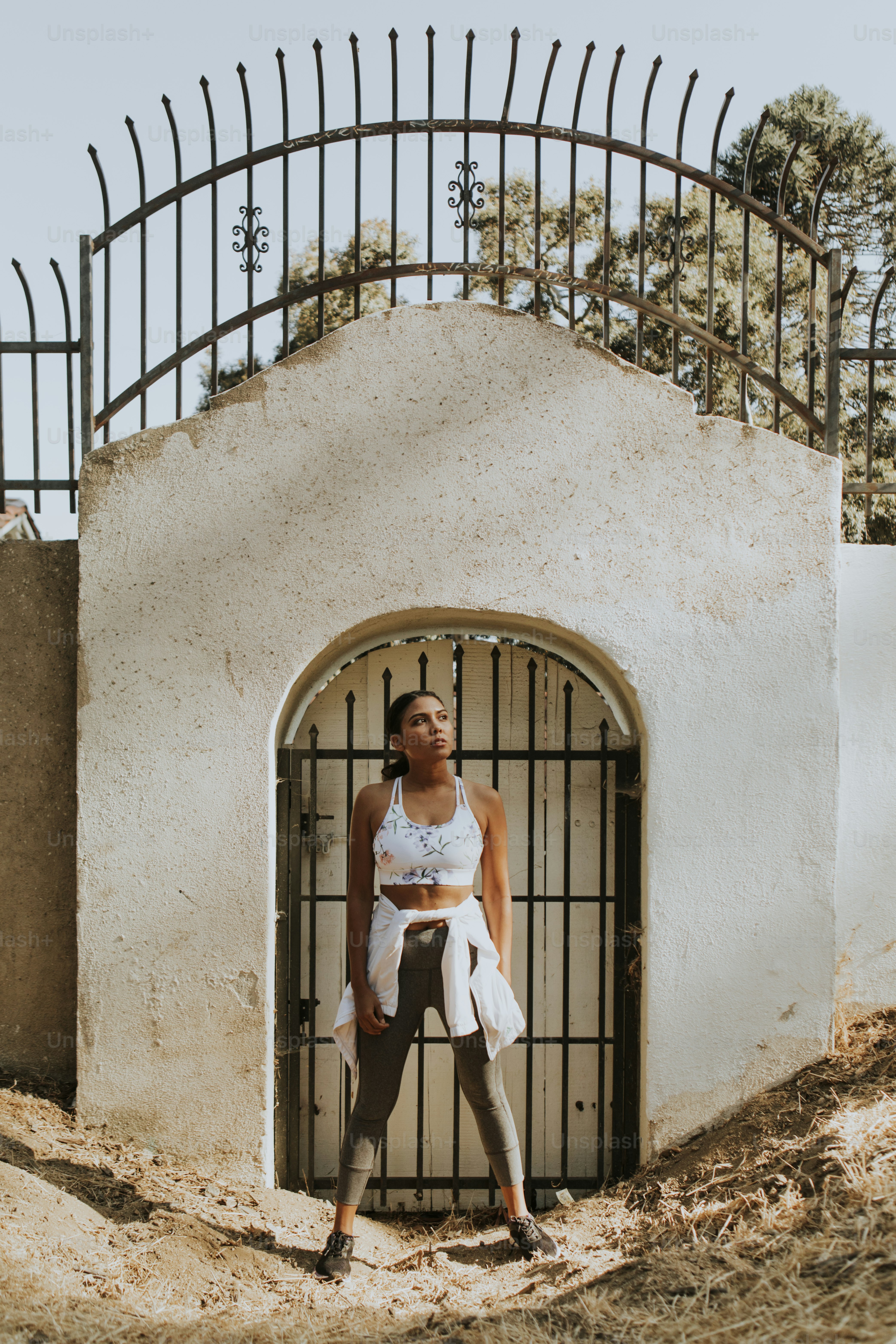 Active woman standing by a gate photo – Summer Image on Unsplash