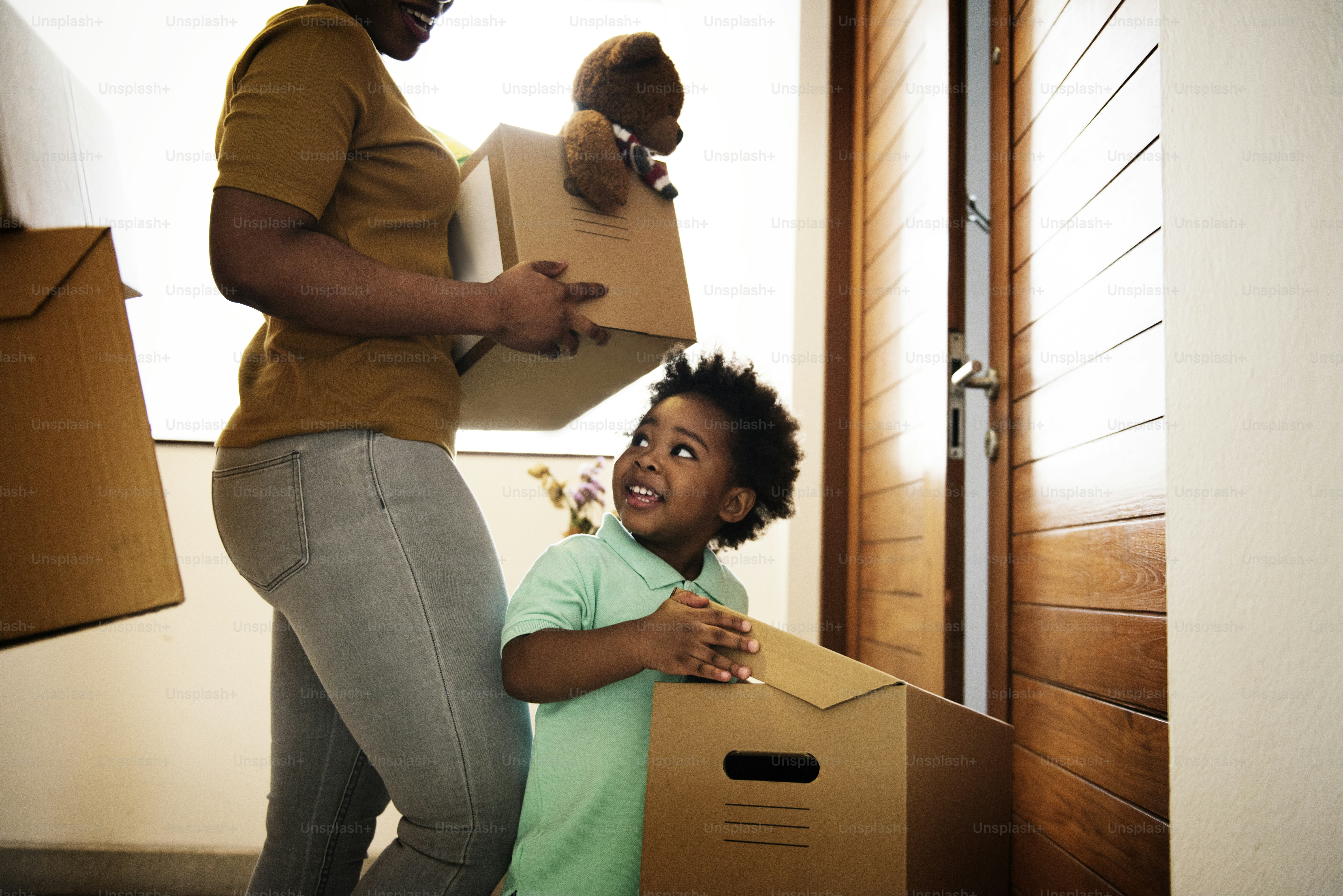 Black family moving in to their new house photo – African ethnicity ...
