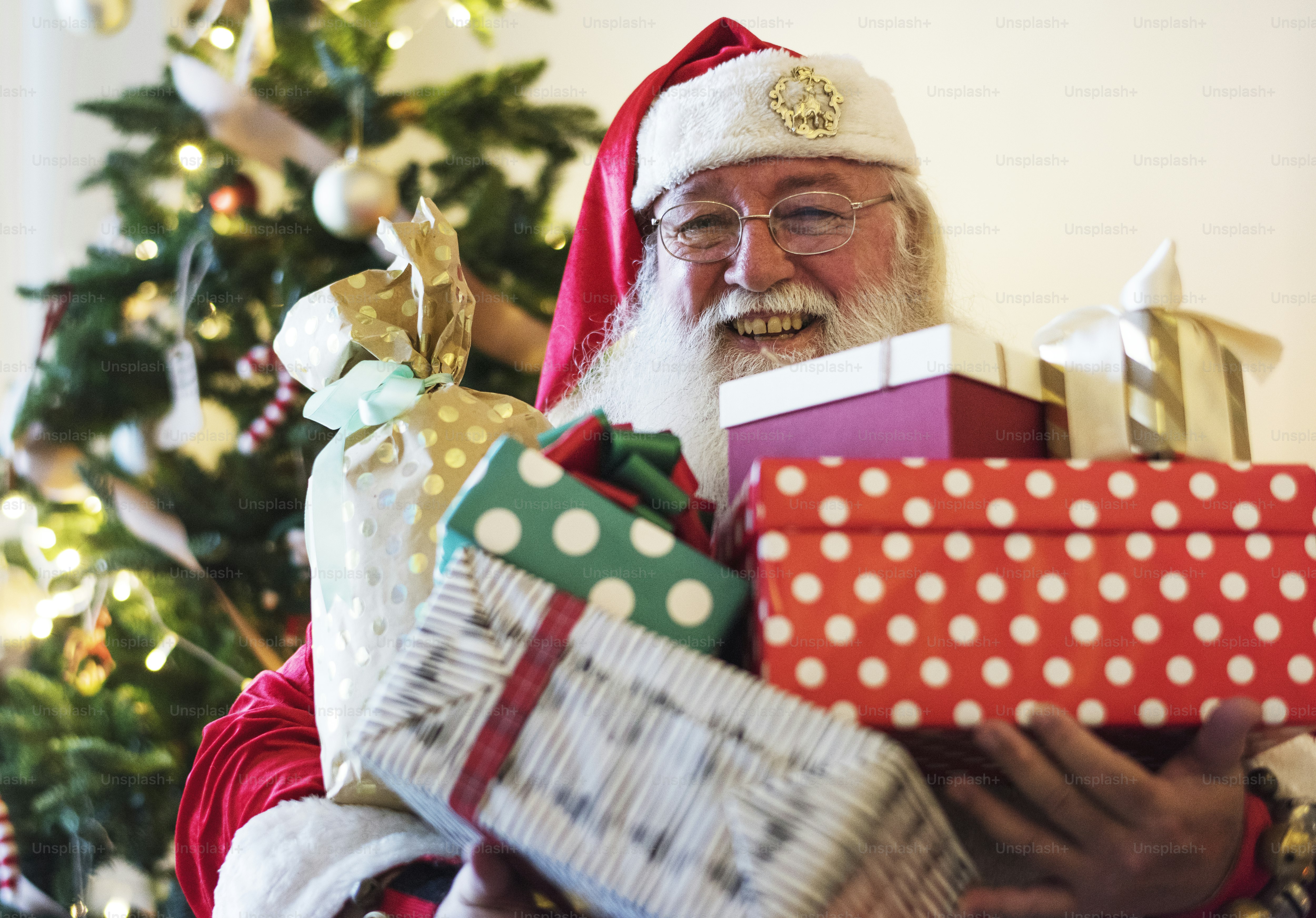 Santa Claus carrying a lot of Christmas presents photo – Decorating the ...