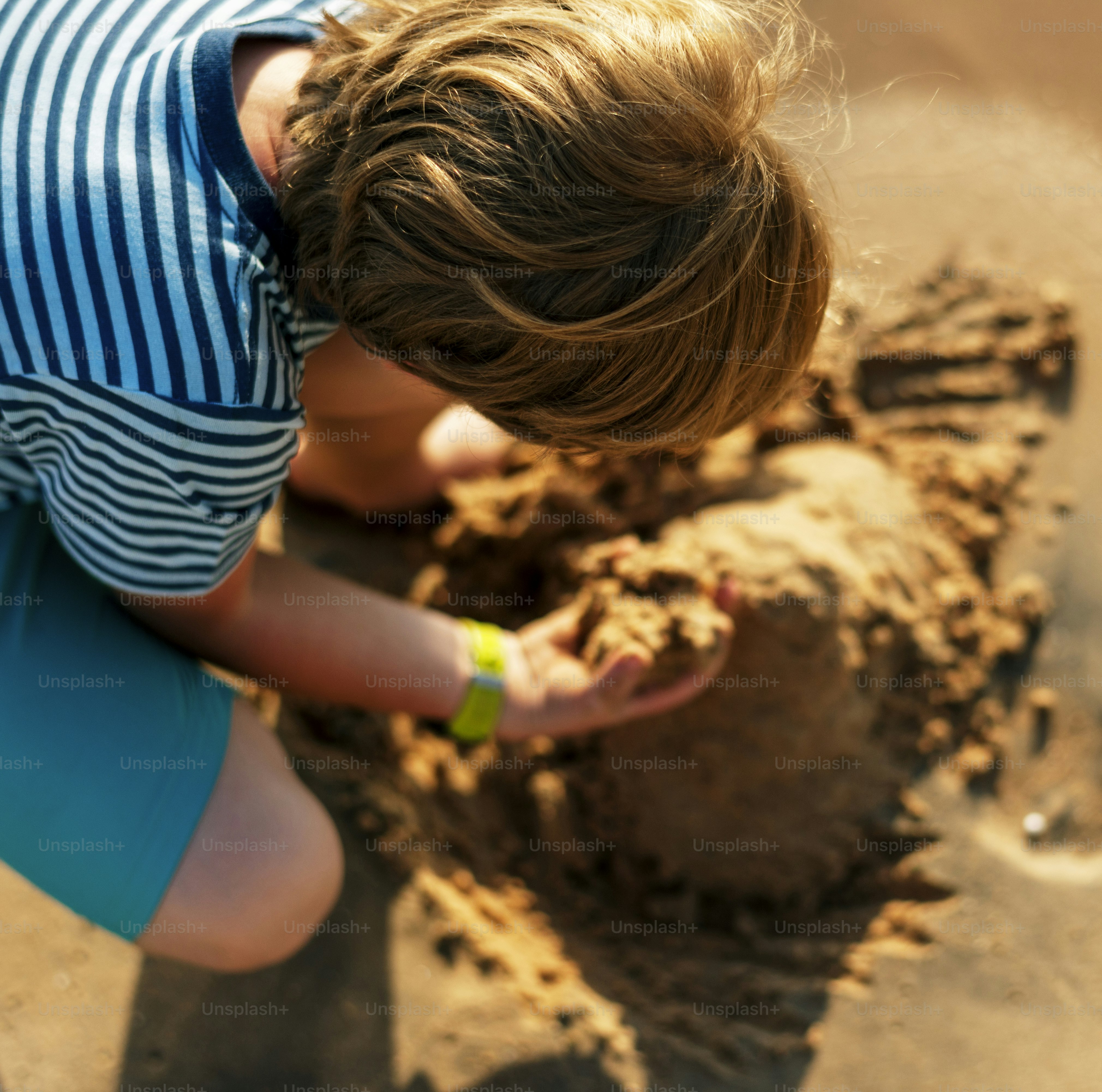 Little boy playing sand by the seashore photo – Summer Image on Unsplash