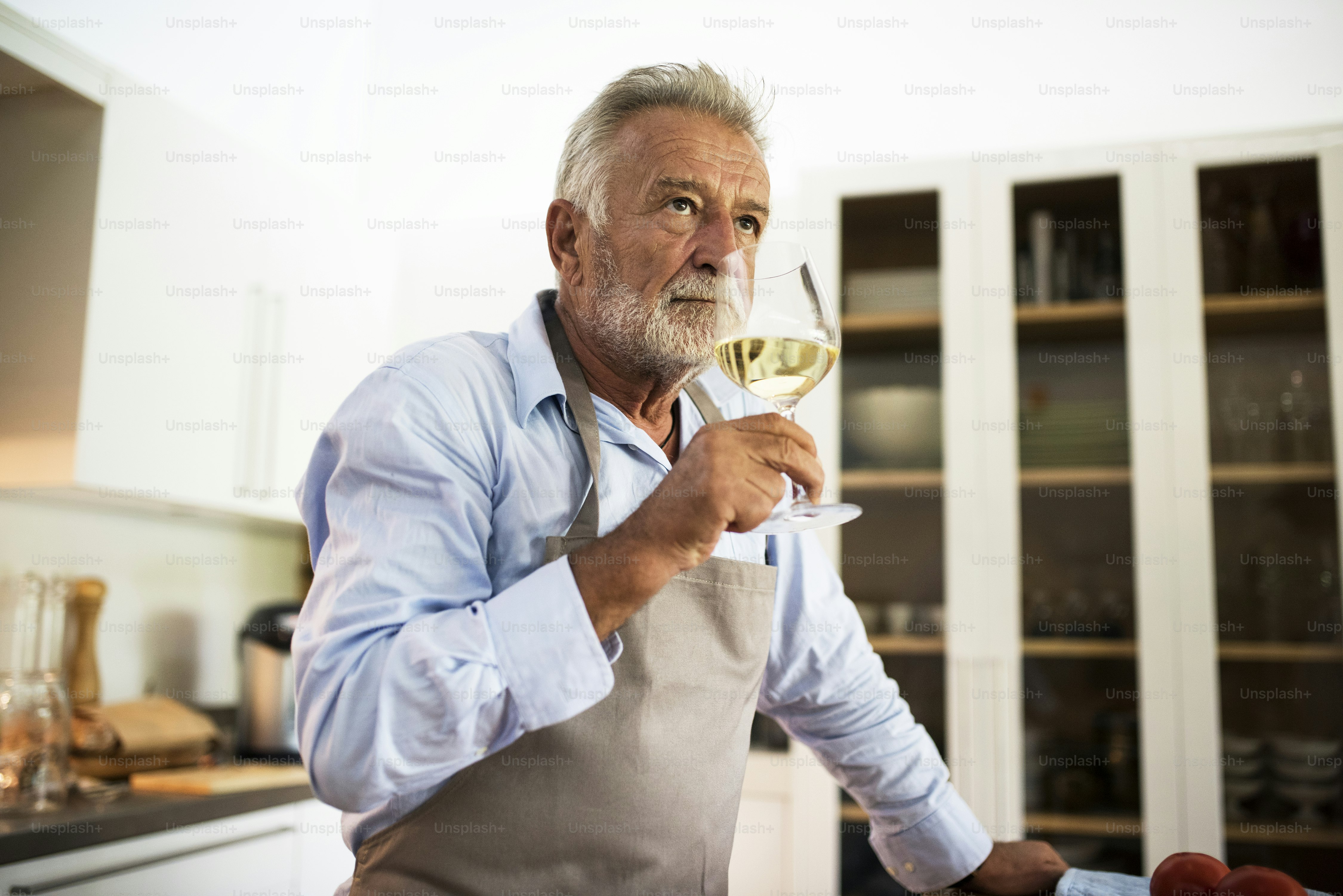 A man drinking a glass of wine photo – Drink Image on Unsplash