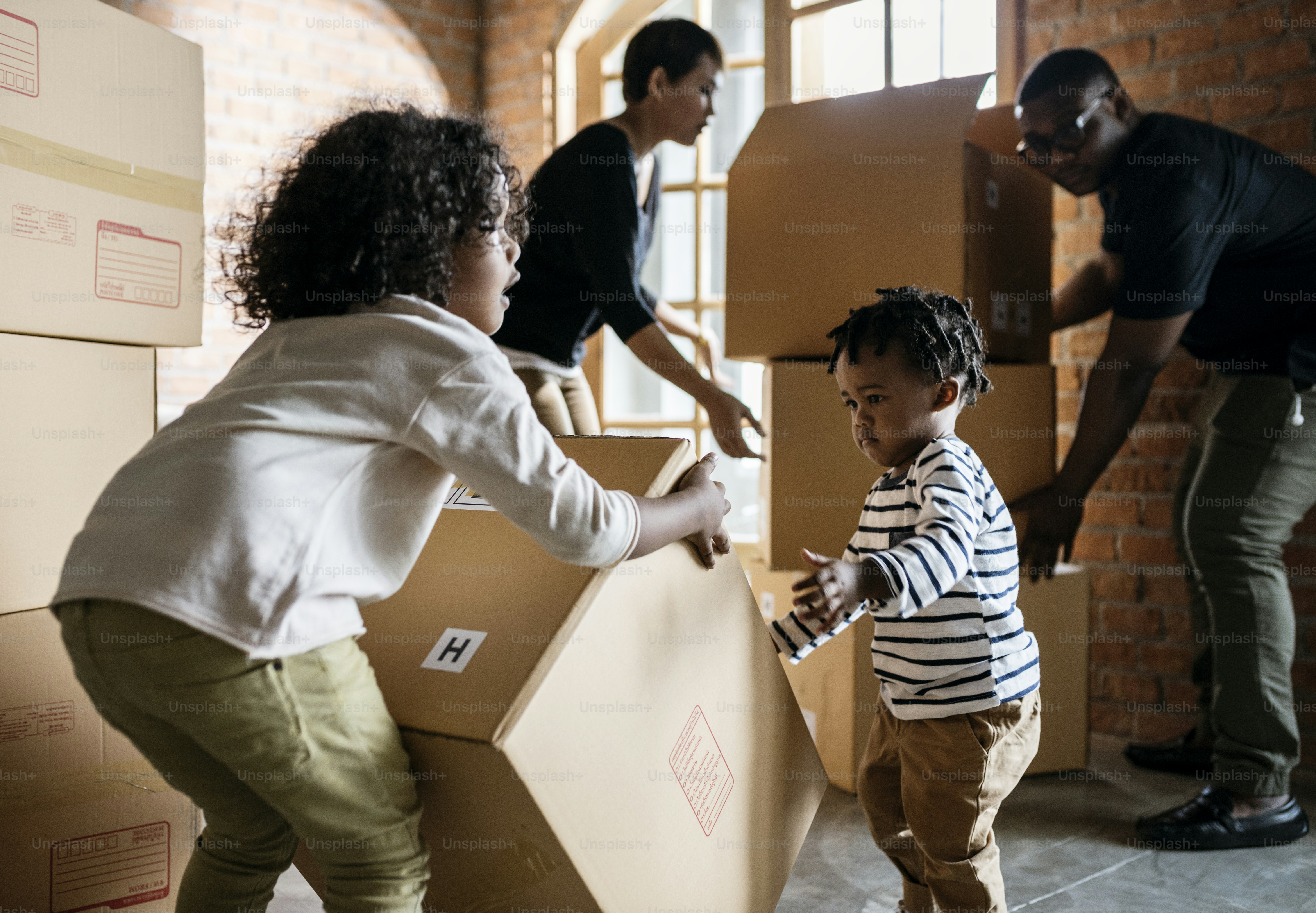 African family unpacking stuffs photo – House Image on Unsplash